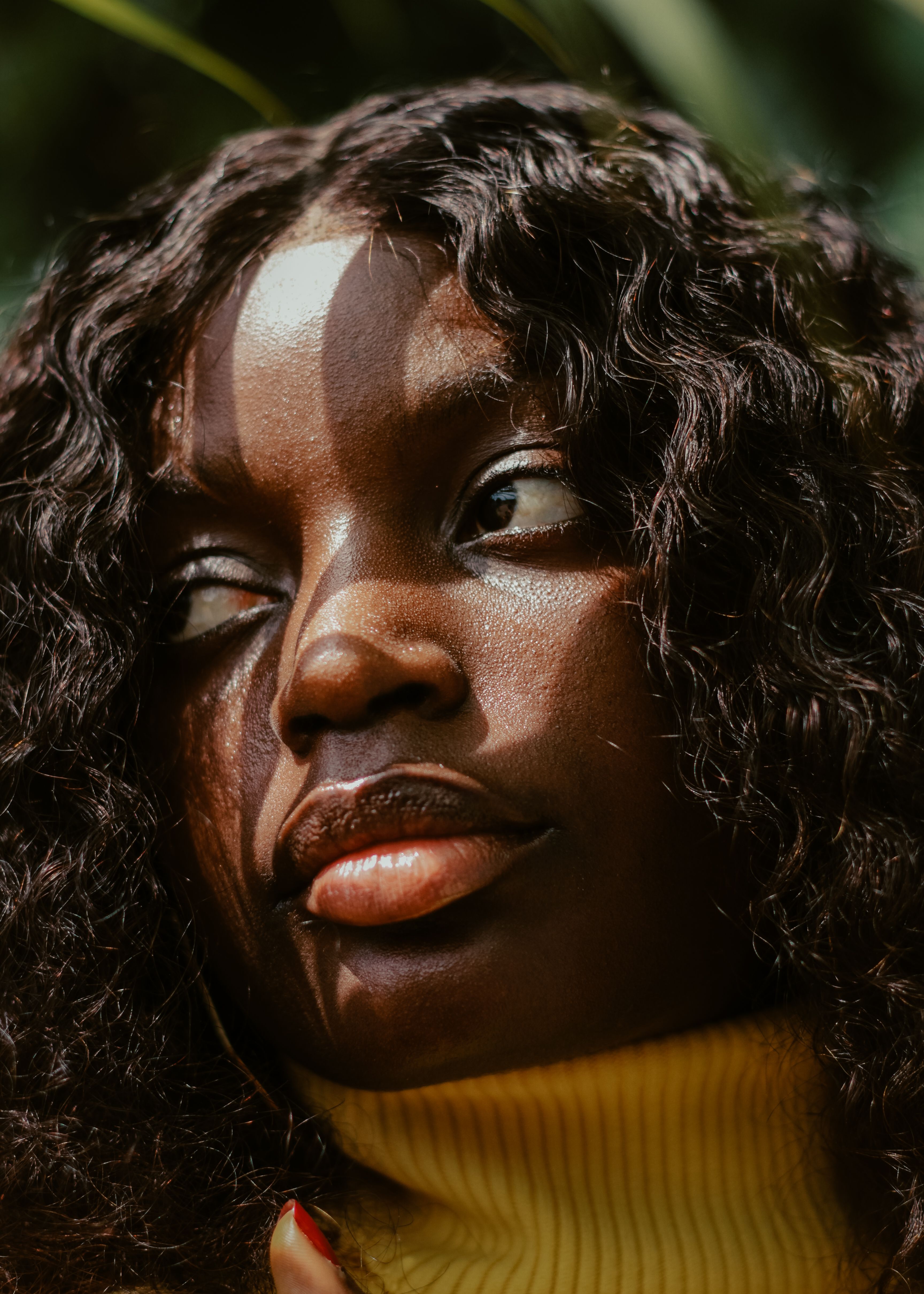 Close-up Portrait of a Reflective Woman Outdoors · Free Stock Photo