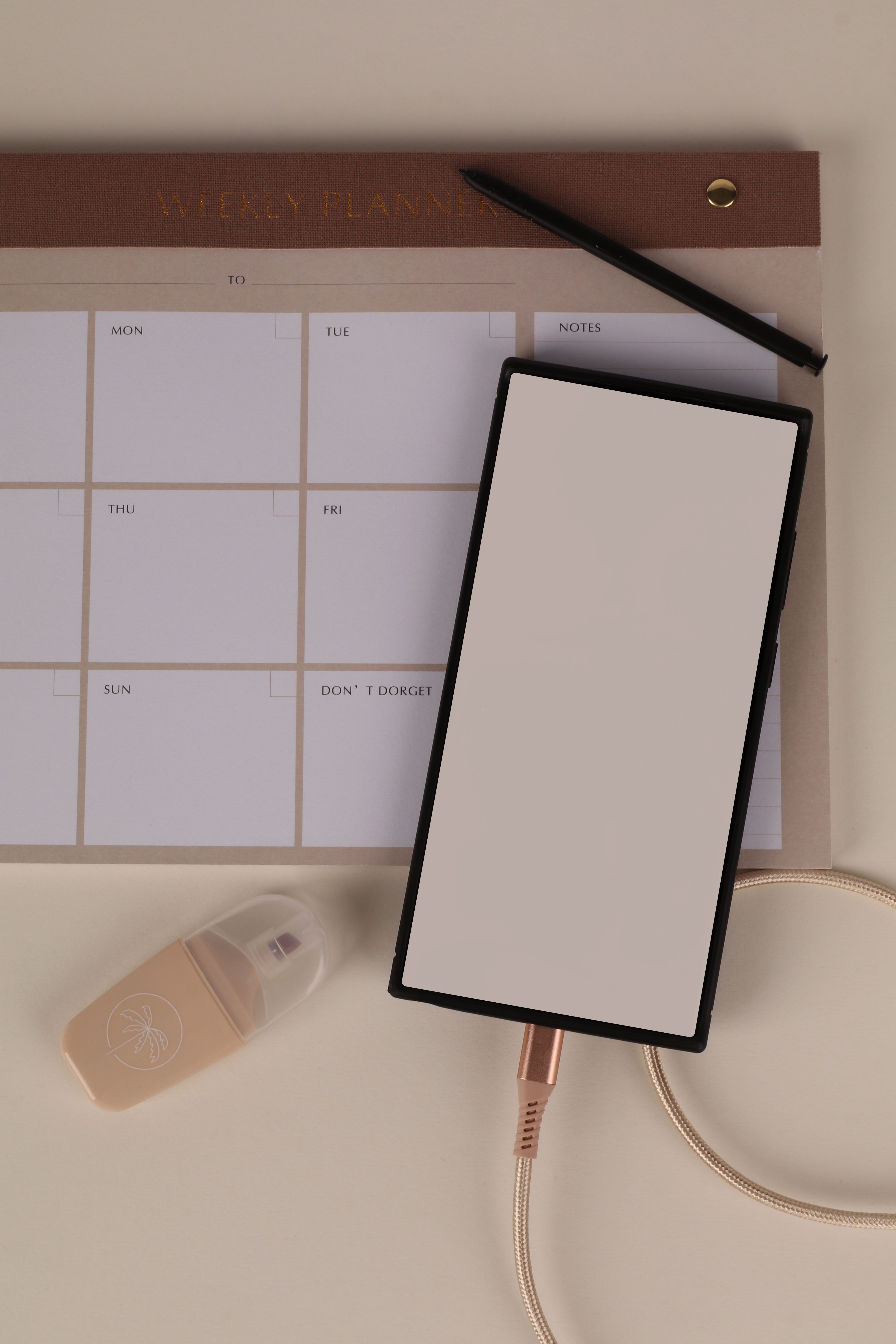 Organized Workspace with Weekly Planner and Phone · Free Stock Photo