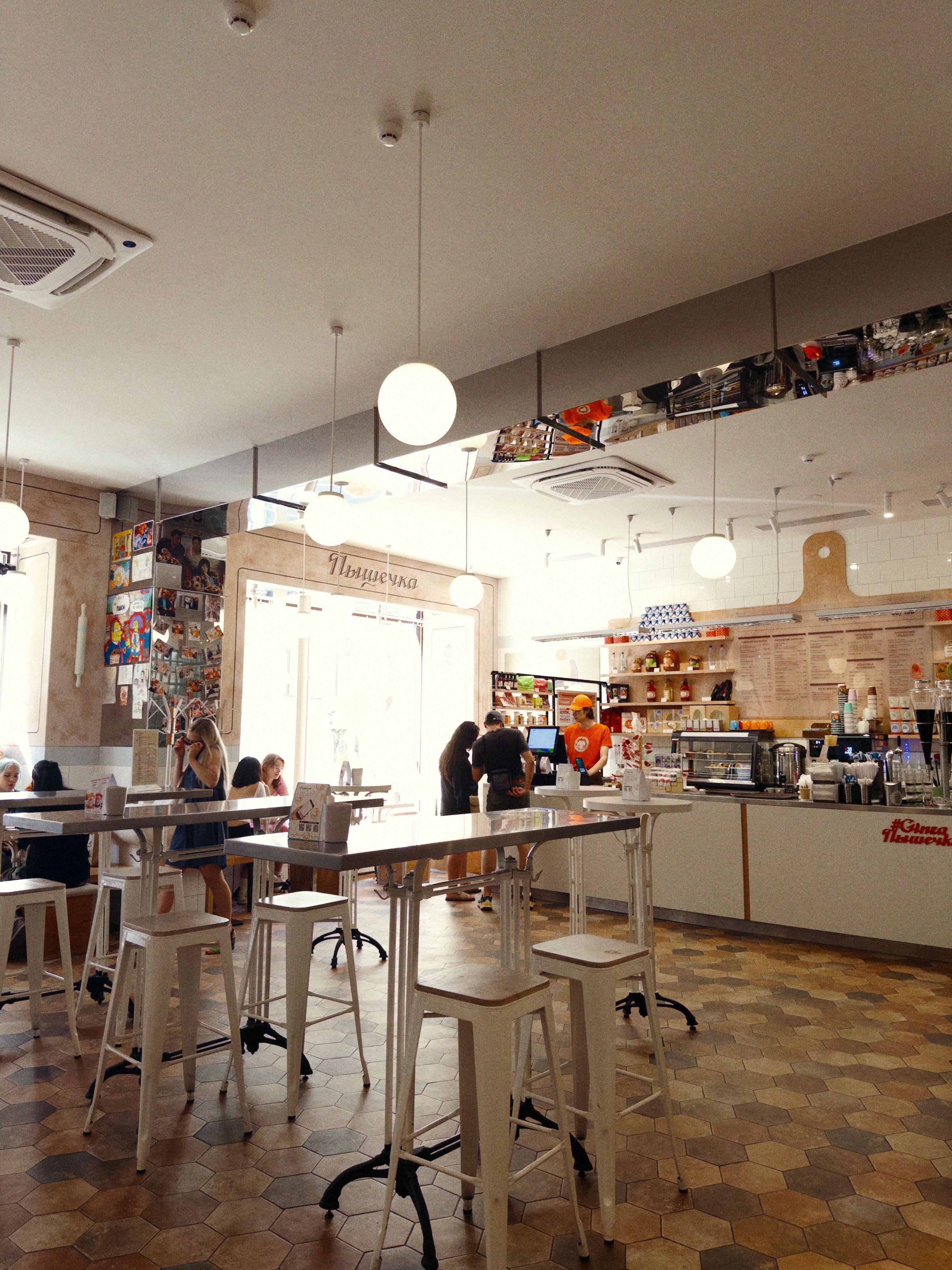 Cozy Cafe Interior with Rustic Decor · Free Stock Photo