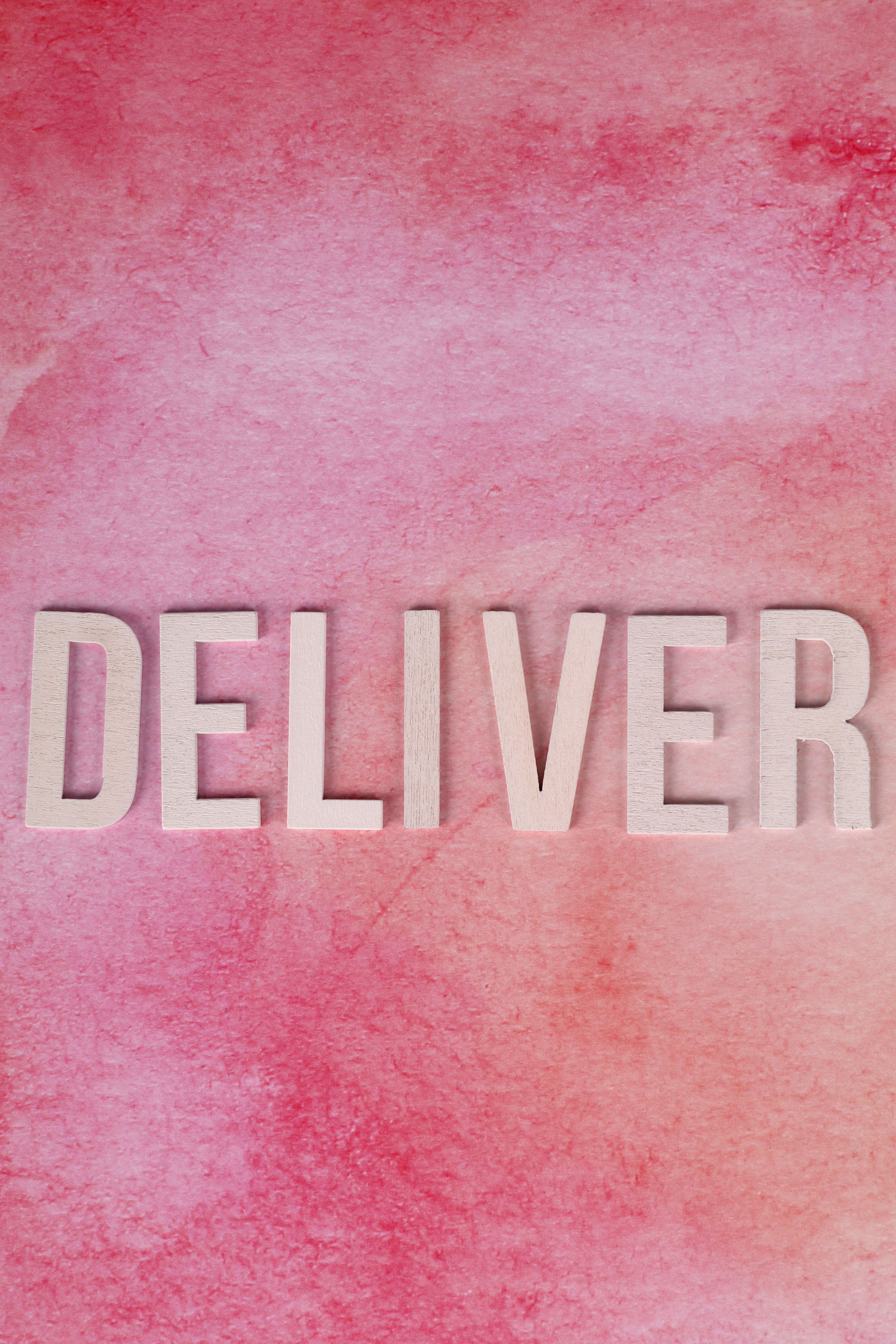 Inspirational Word Deliver on Pink Background · Free Stock Photo