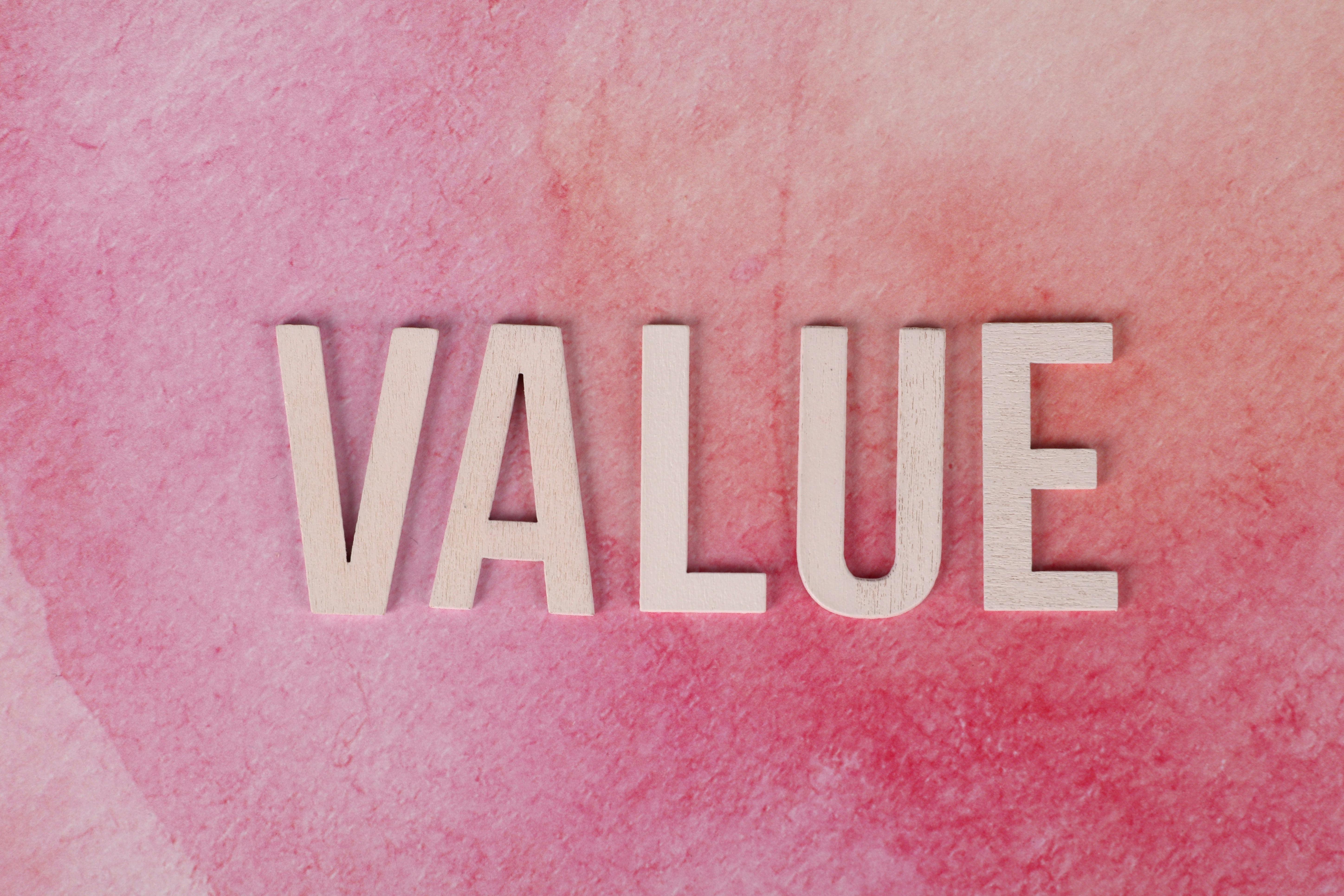 Pink Background with 'VALUE' Text in Bold Letters · Free Stock Photo