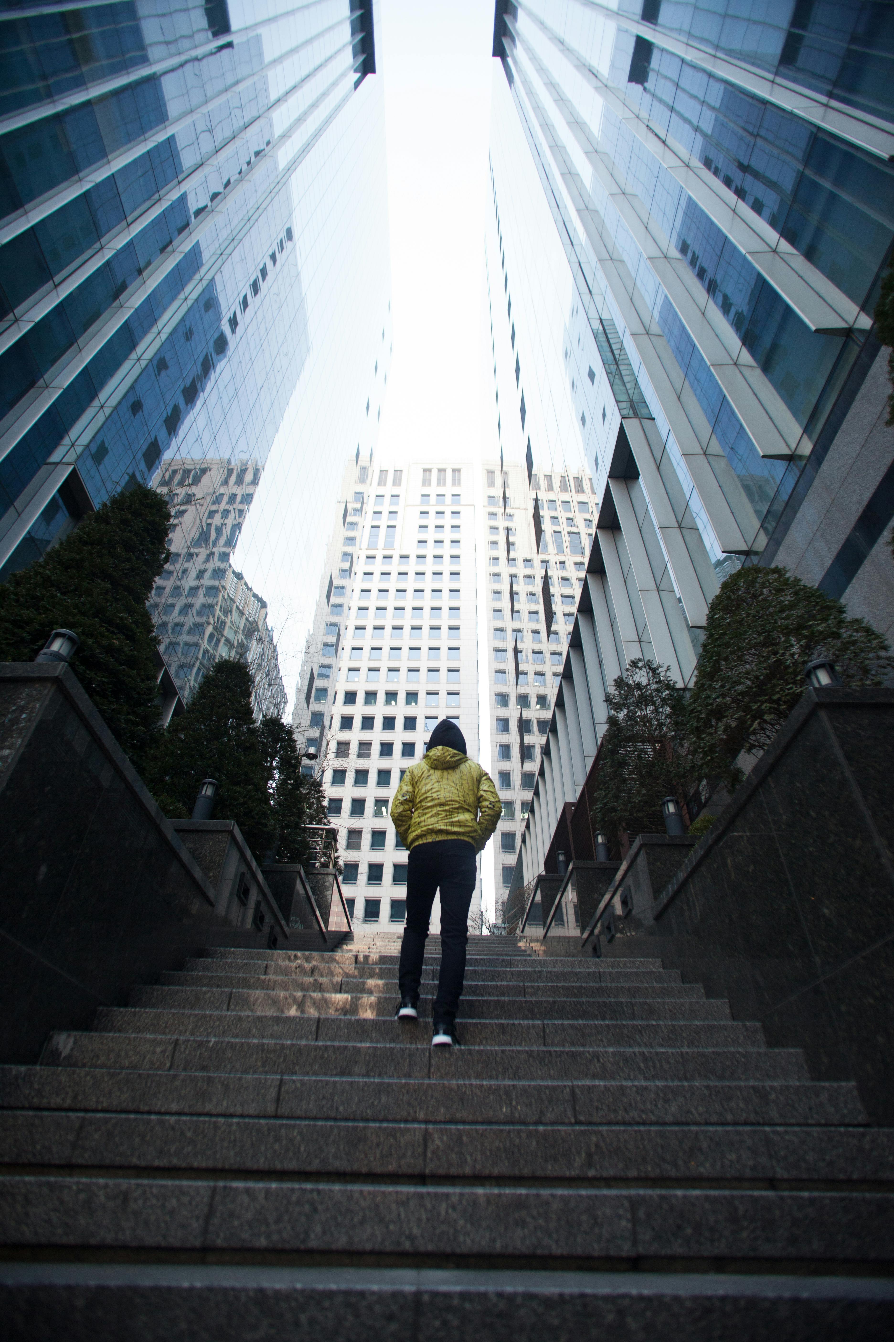 Low-angle Photography of a Person Walking Up a Stairs · Free Stock Photo