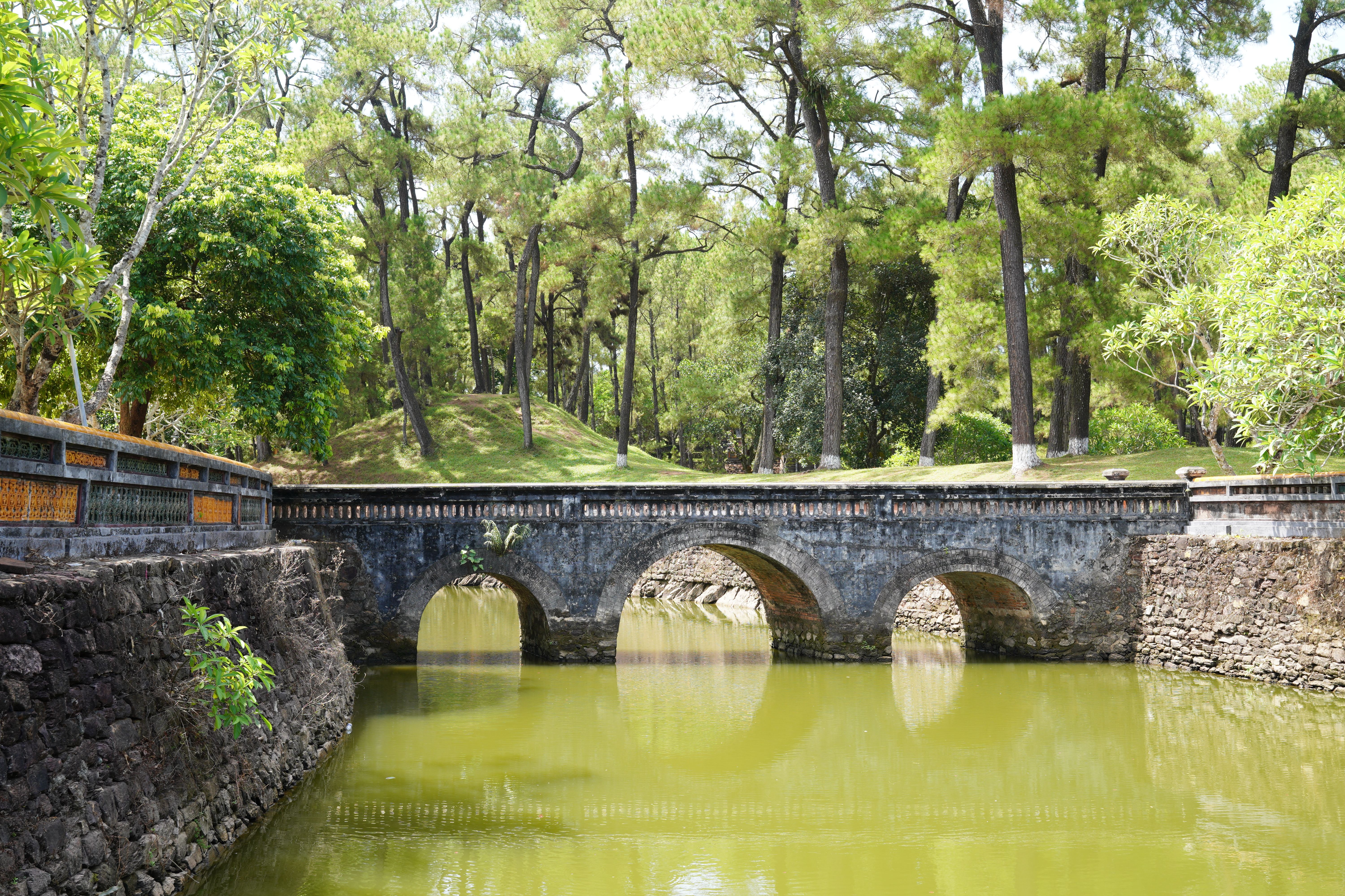 Scenic Stone Bridge Over Serene Pond in Park · Free Stock Photo