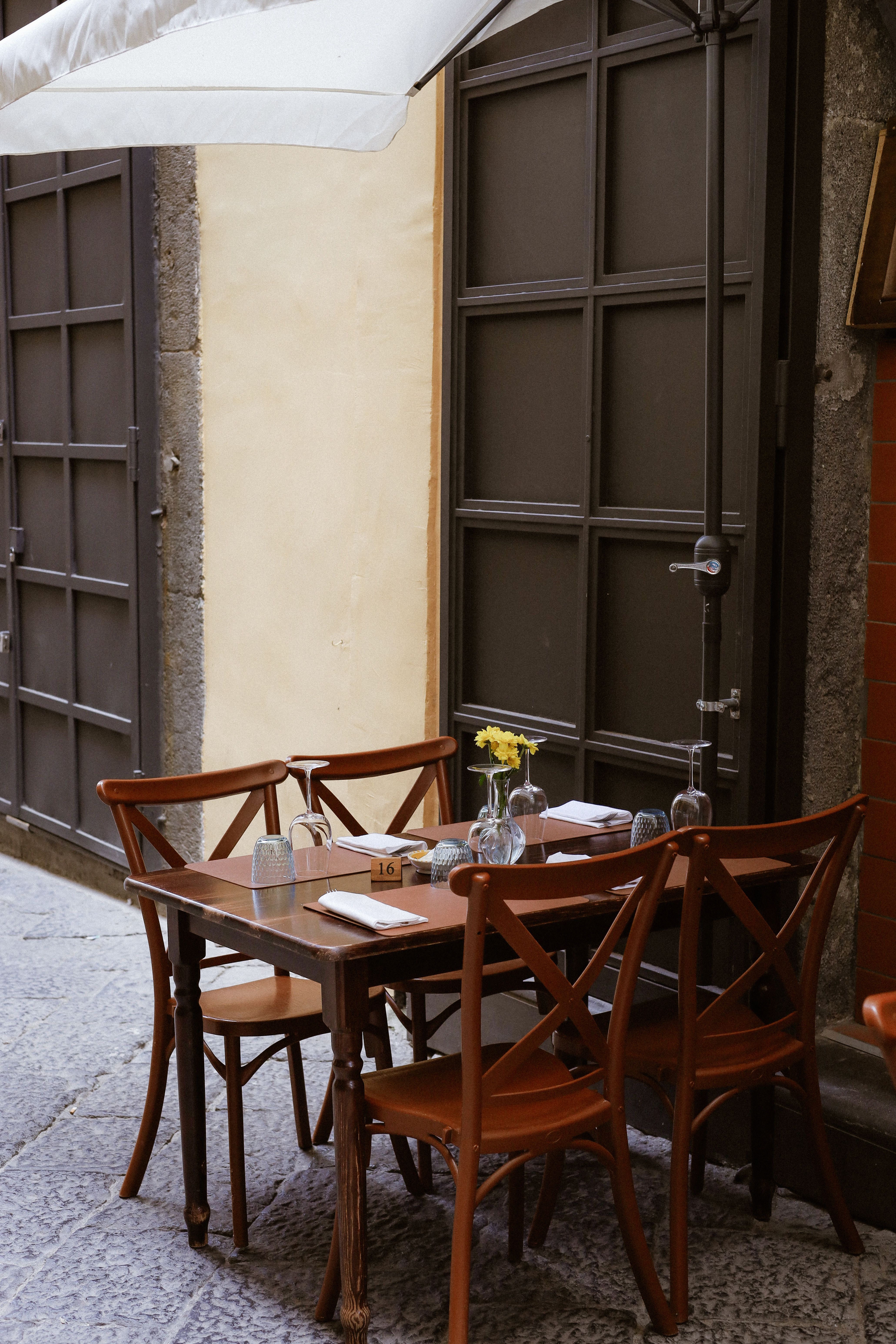 Charming Outdoor Cafe Table Setting on Cobblestone Street · Free Stock ...