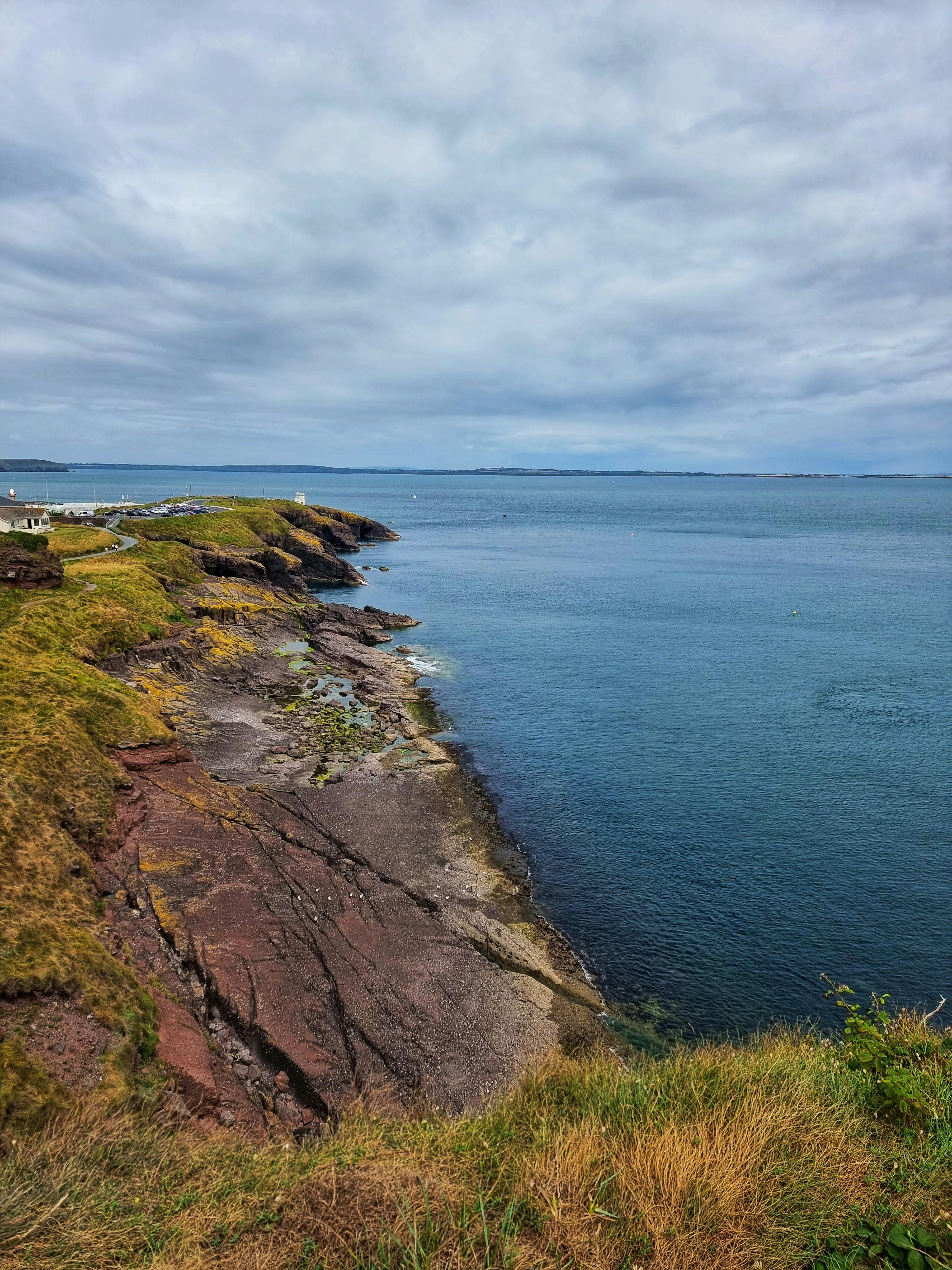 Scenic Coastal Cliff View with Ocean Horizon · Free Stock Photo