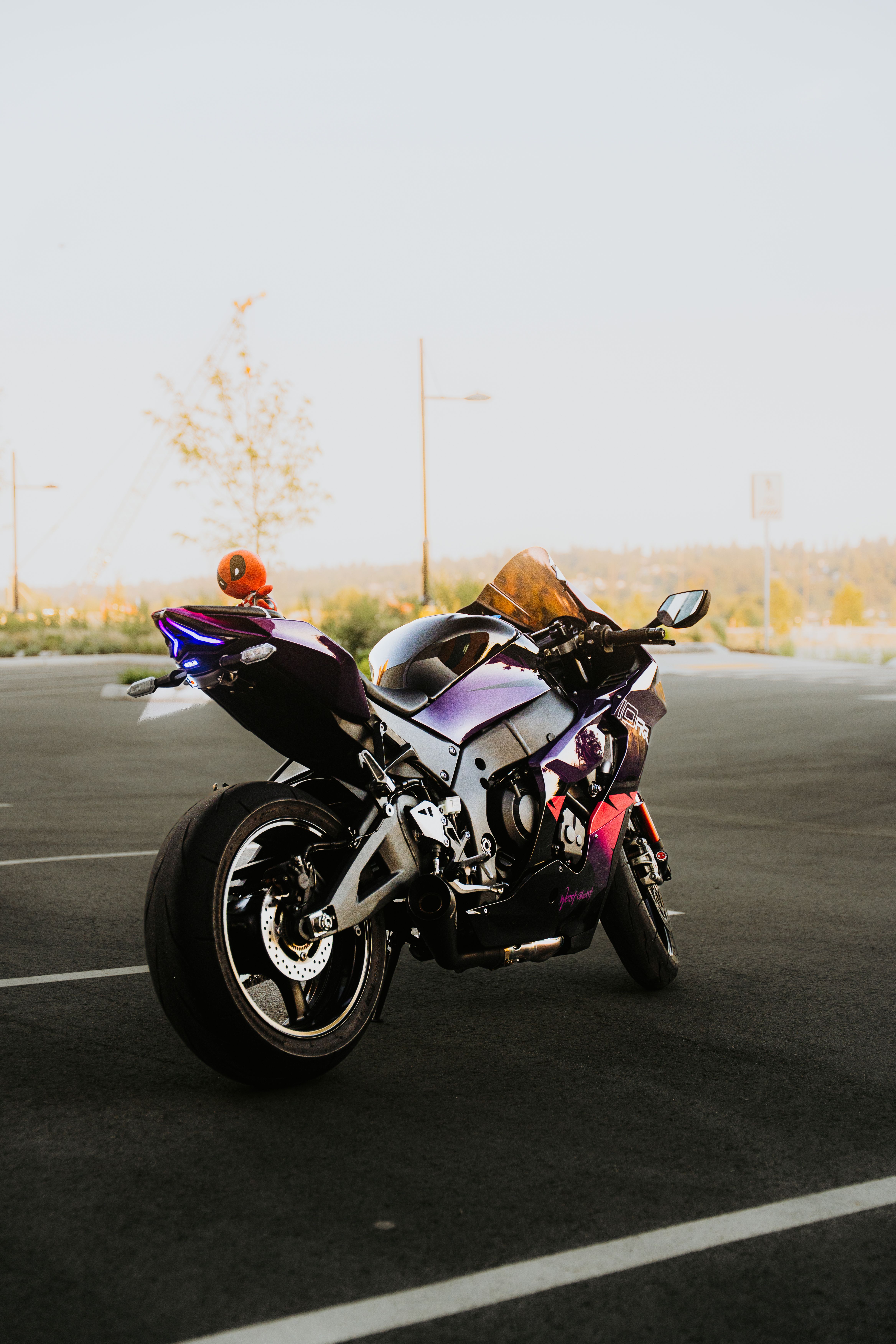 Violet Sport Motorcycle Parked in Urban Setting · Free Stock Photo