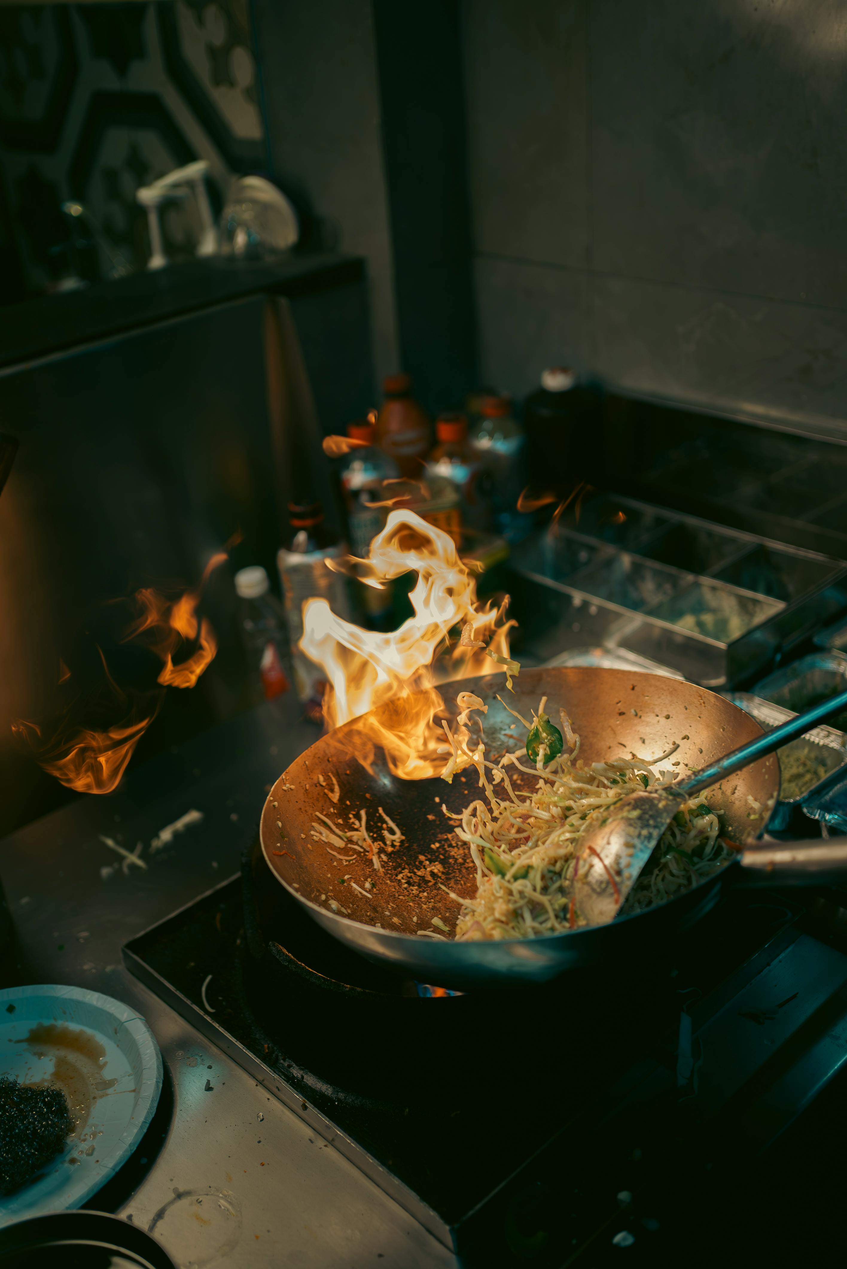 Dynamic Stir-Fry Cooking with Flames · Free Stock Photo