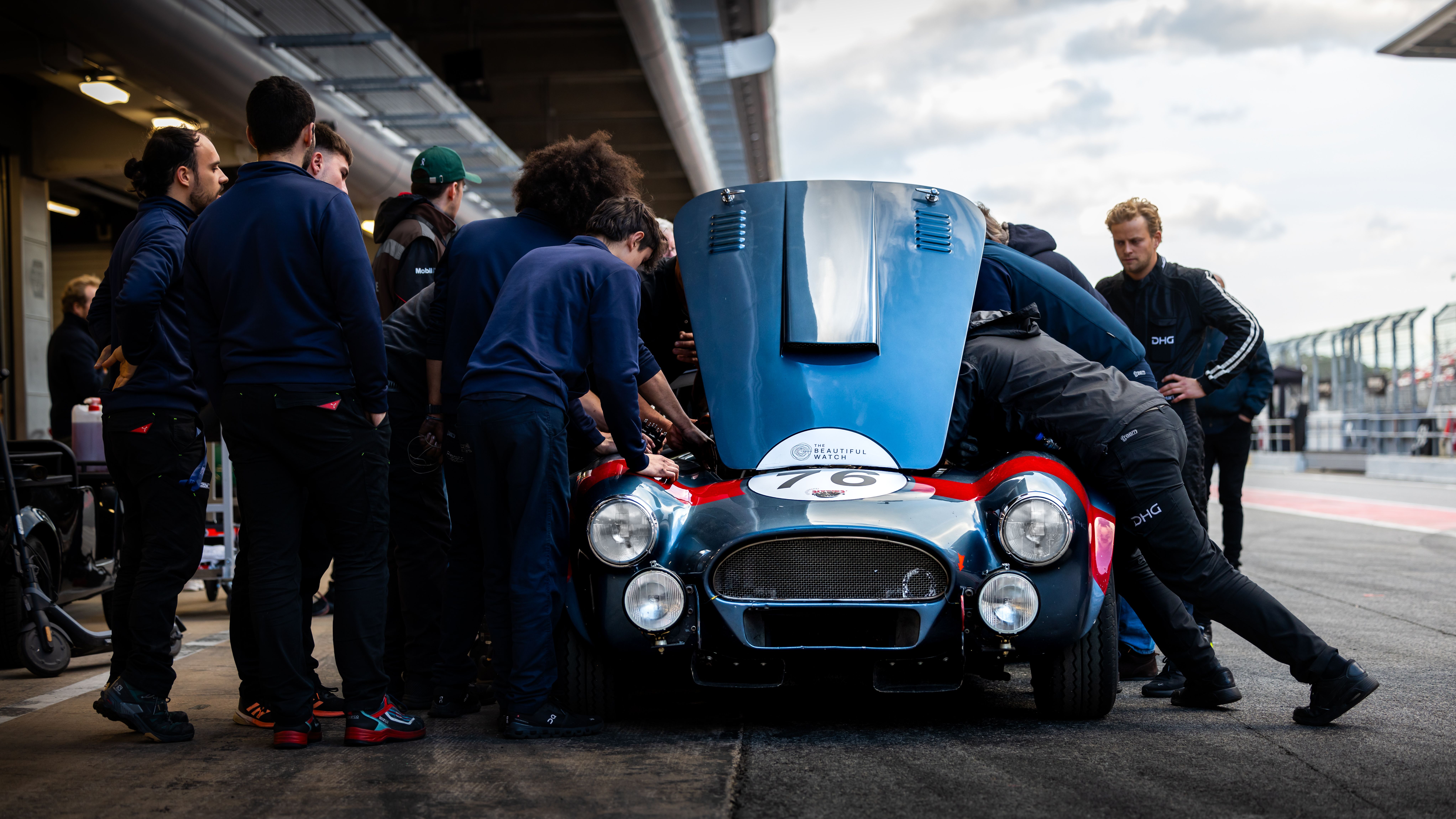 Team of Engineers Working on Classic Race Car in Pit Lane · Free Stock ...
