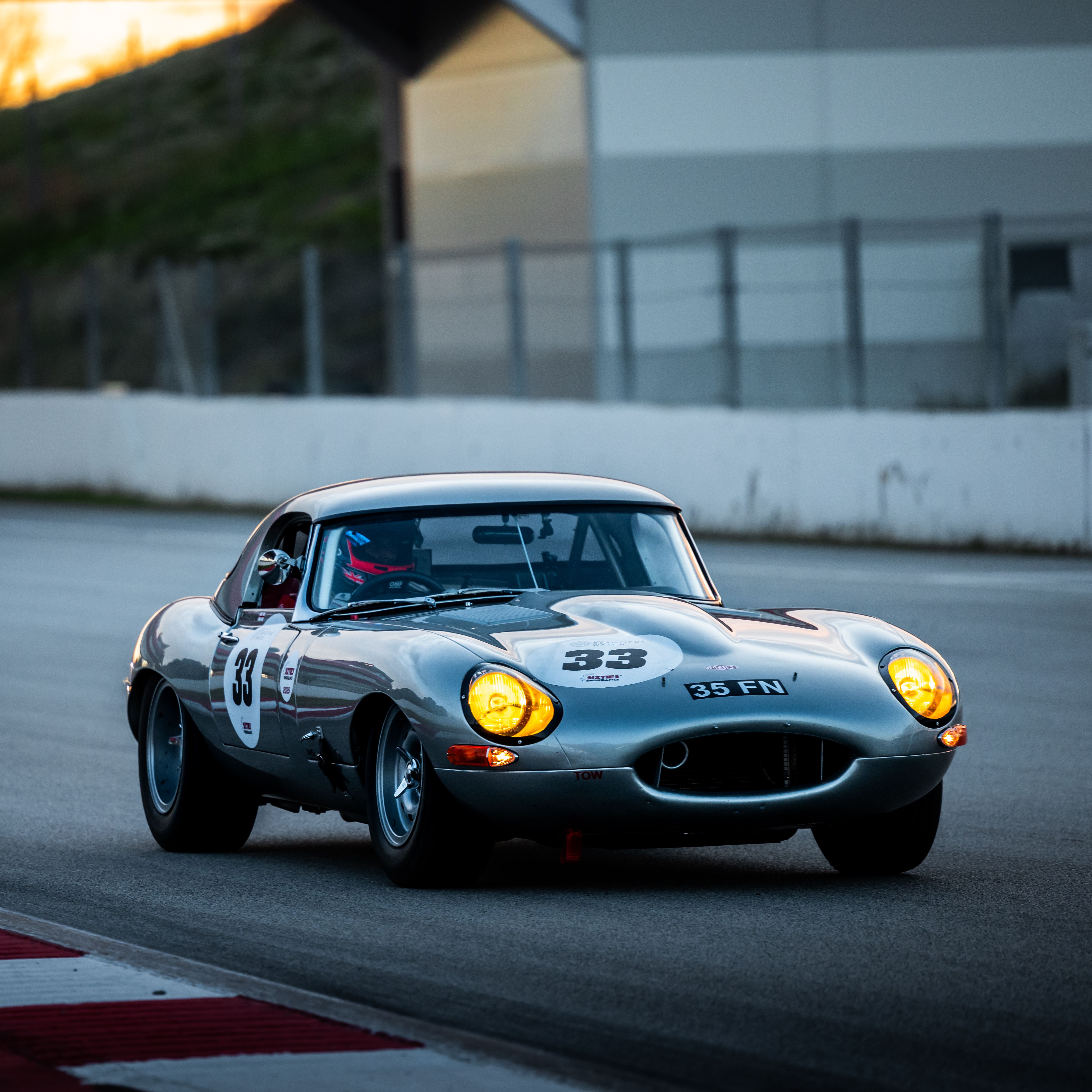 Classic Racing Car on Track at Dusk · Free Stock Photo