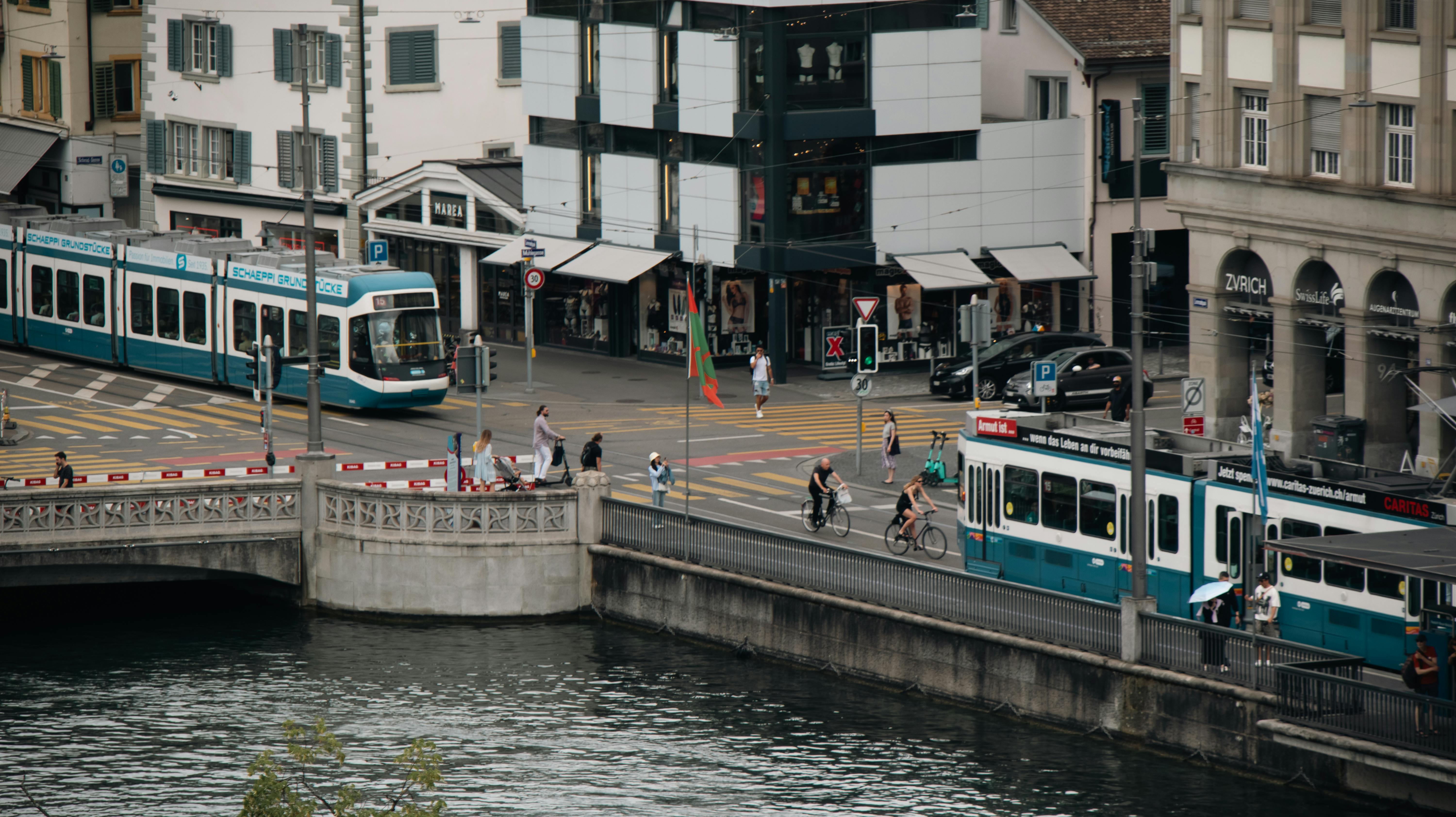 Busy Zürich Street with Trams and Cyclists · Free Stock Photo
