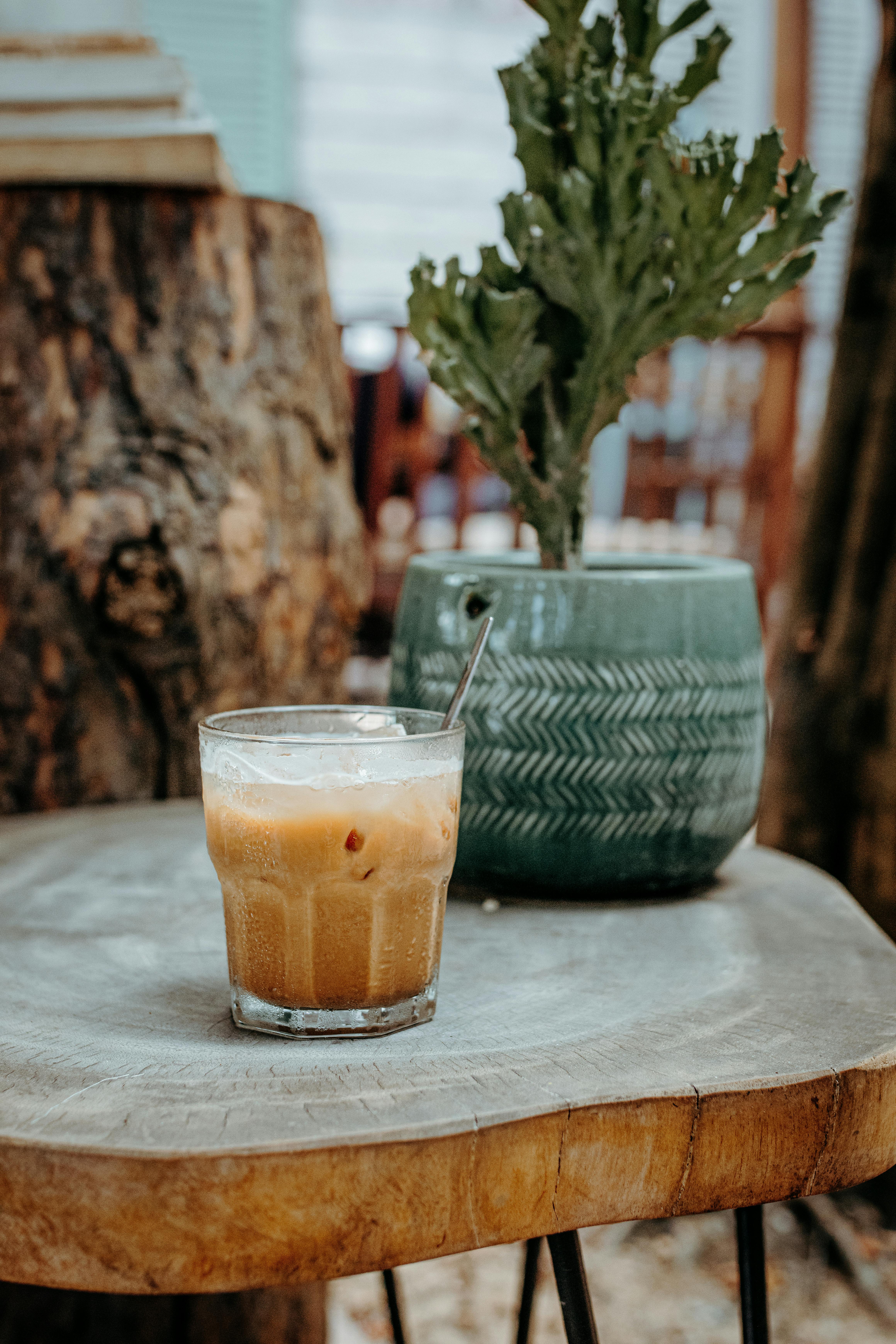 Rustic Cafe Table with Espresso and Planter · Free Stock Photo