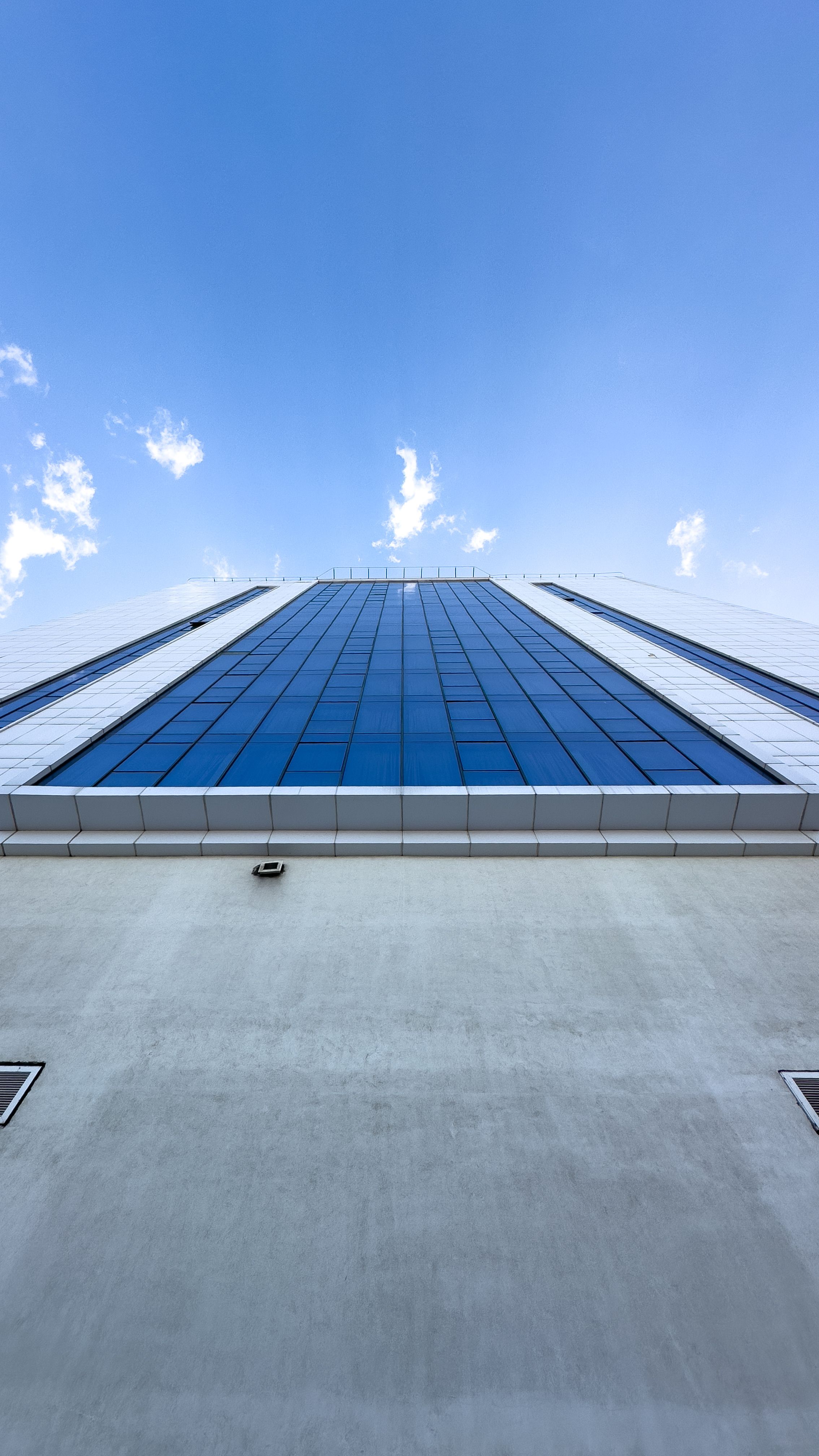 Upward View of Modern Blue Glass Skyscraper · Free Stock Photo