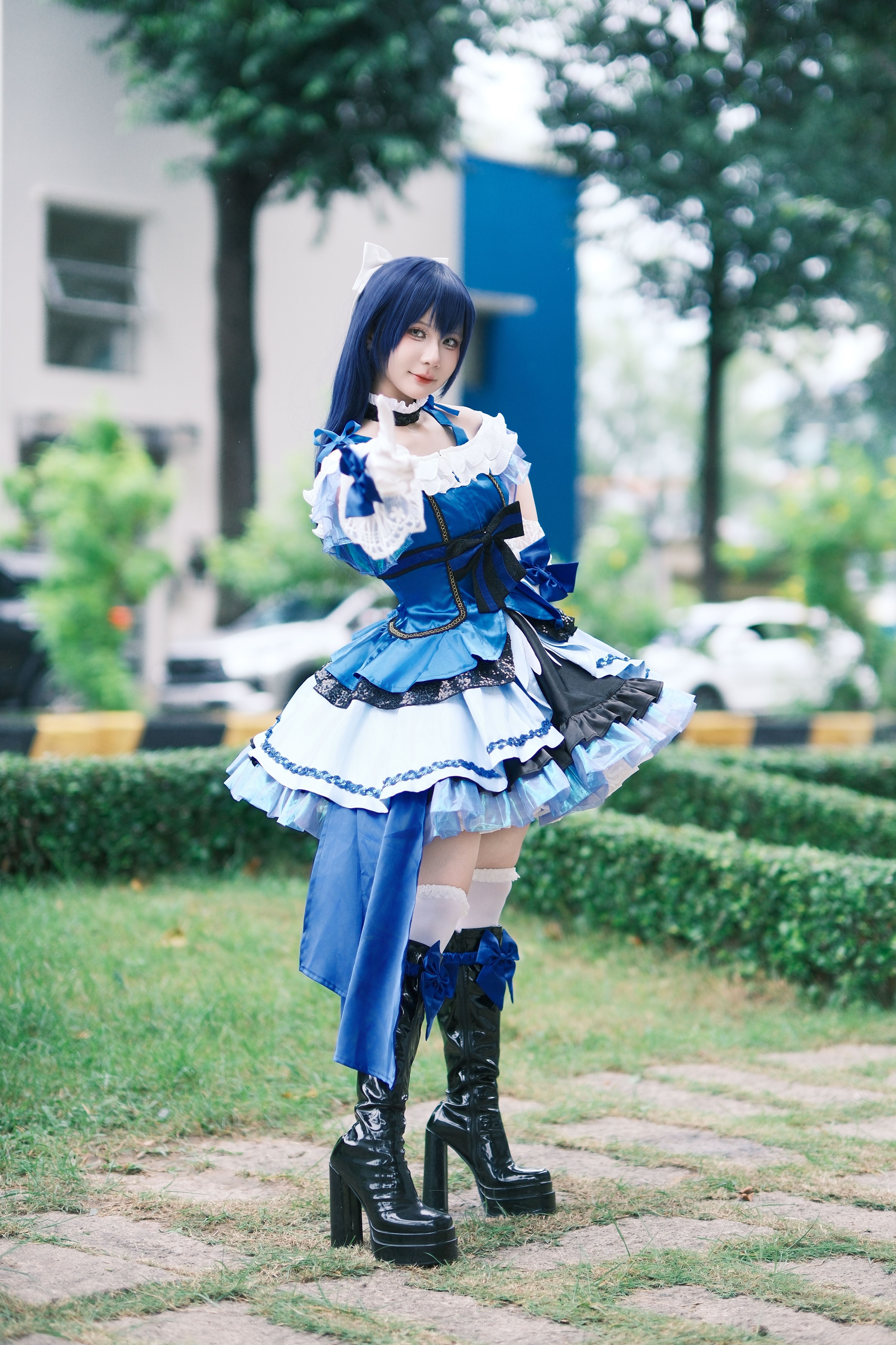 Cosplayer in Blue Costume Posing Outdoors · Free Stock Photo