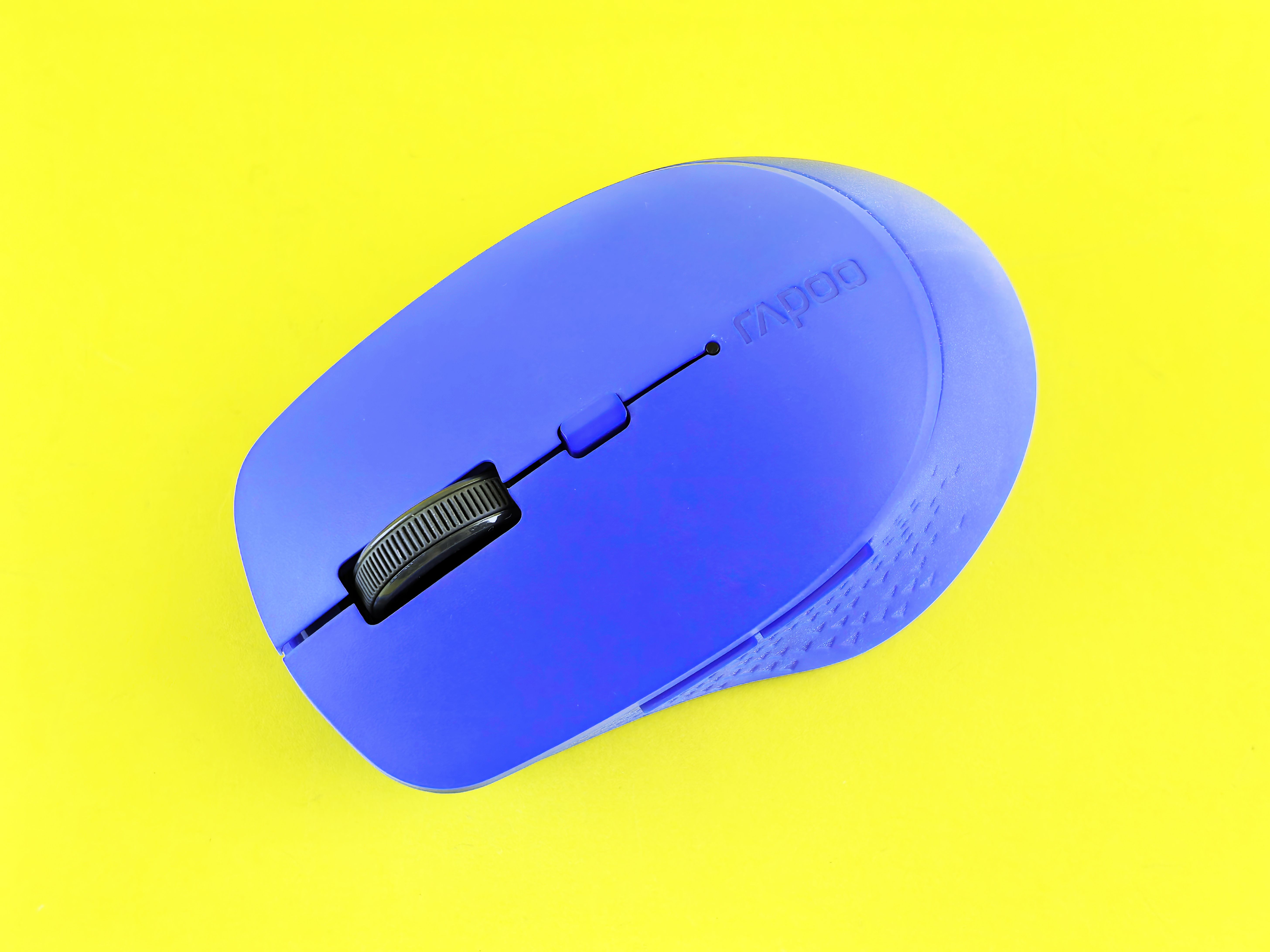 Vibrant Blue Wireless Mouse on Yellow Background · Free Stock Photo