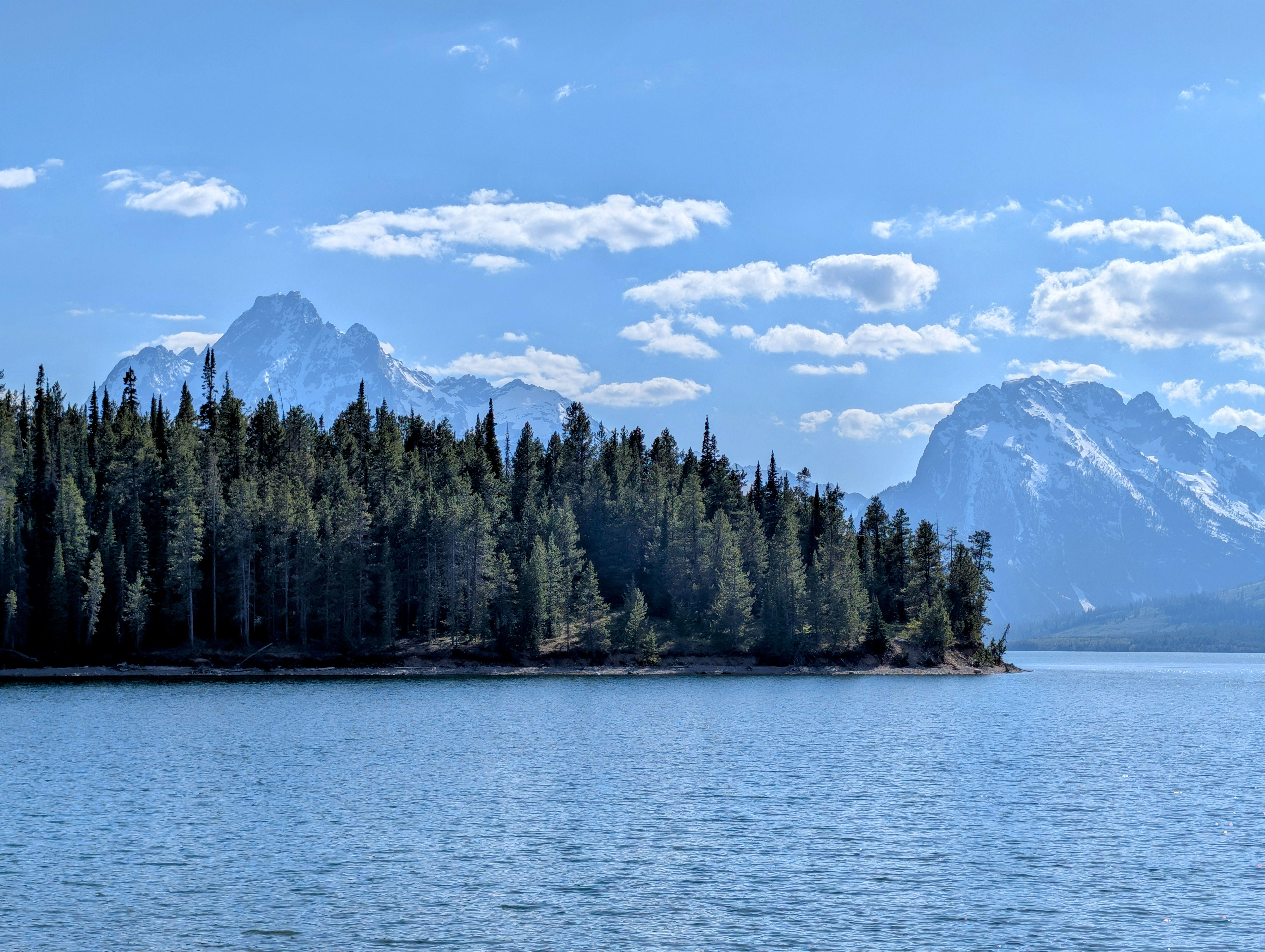 Scenic View of Grand Teton Peaks Over Water · Free Stock Photo