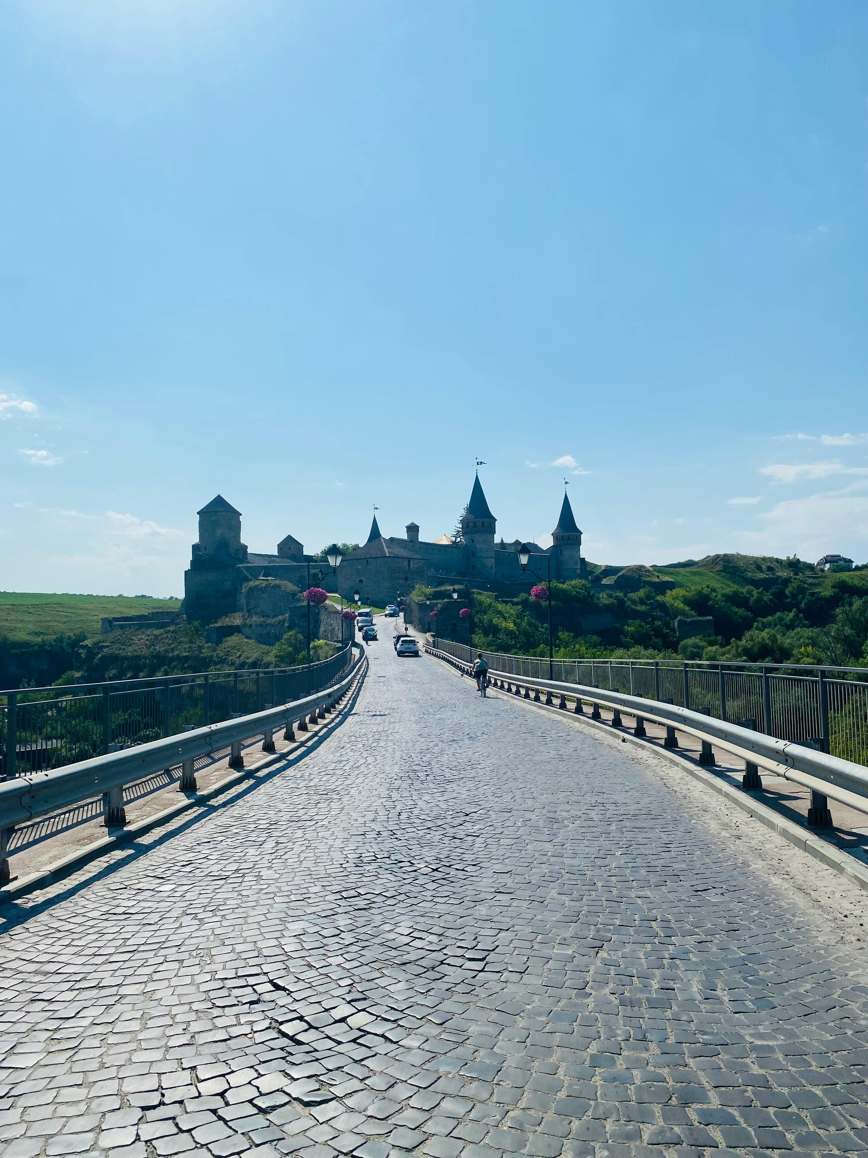 Majestic Castle View from Cobblestone Bridge · Free Stock Photo