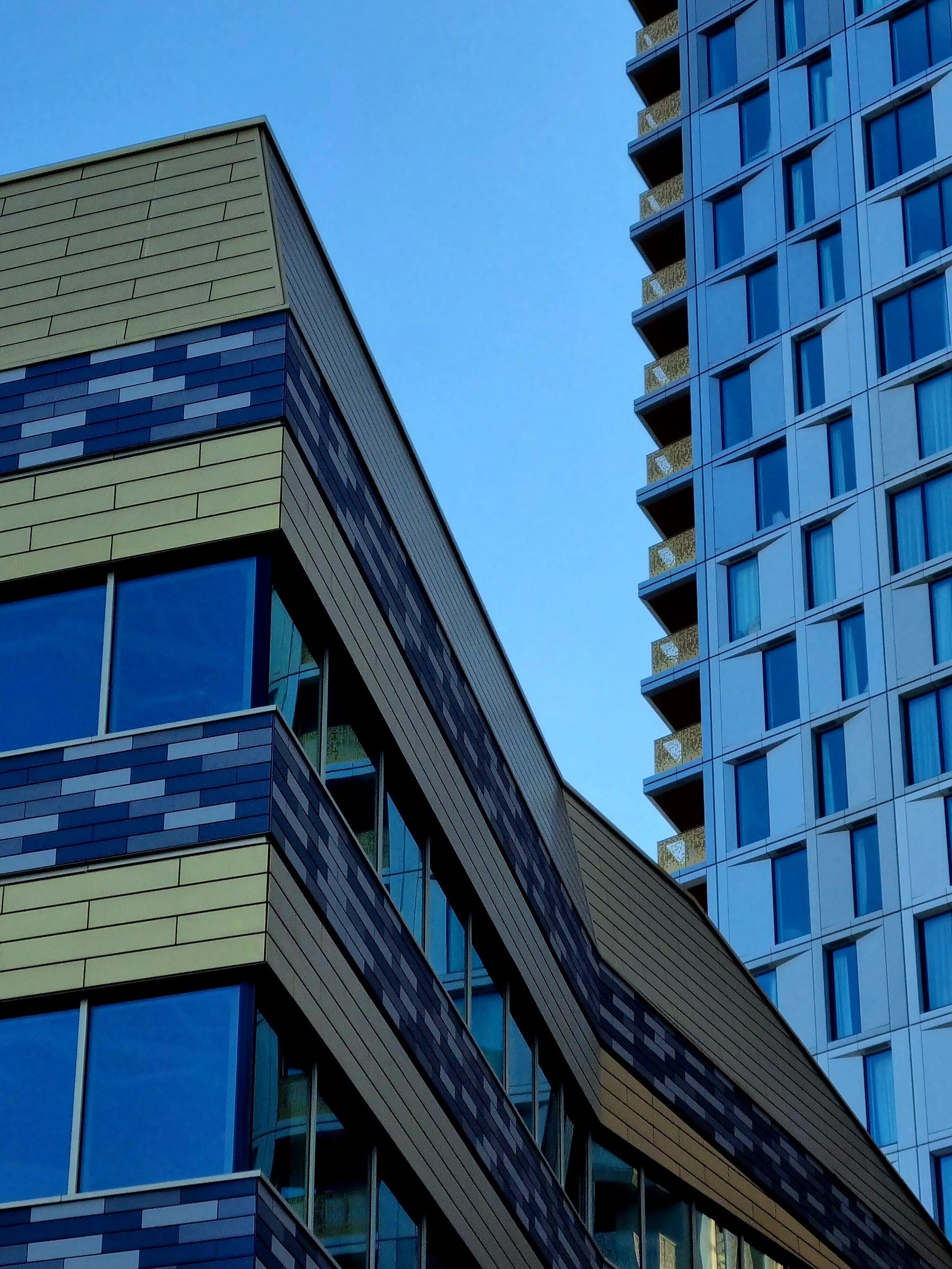 Modern Architecture Against Clear Blue Sky · Free Stock Photo