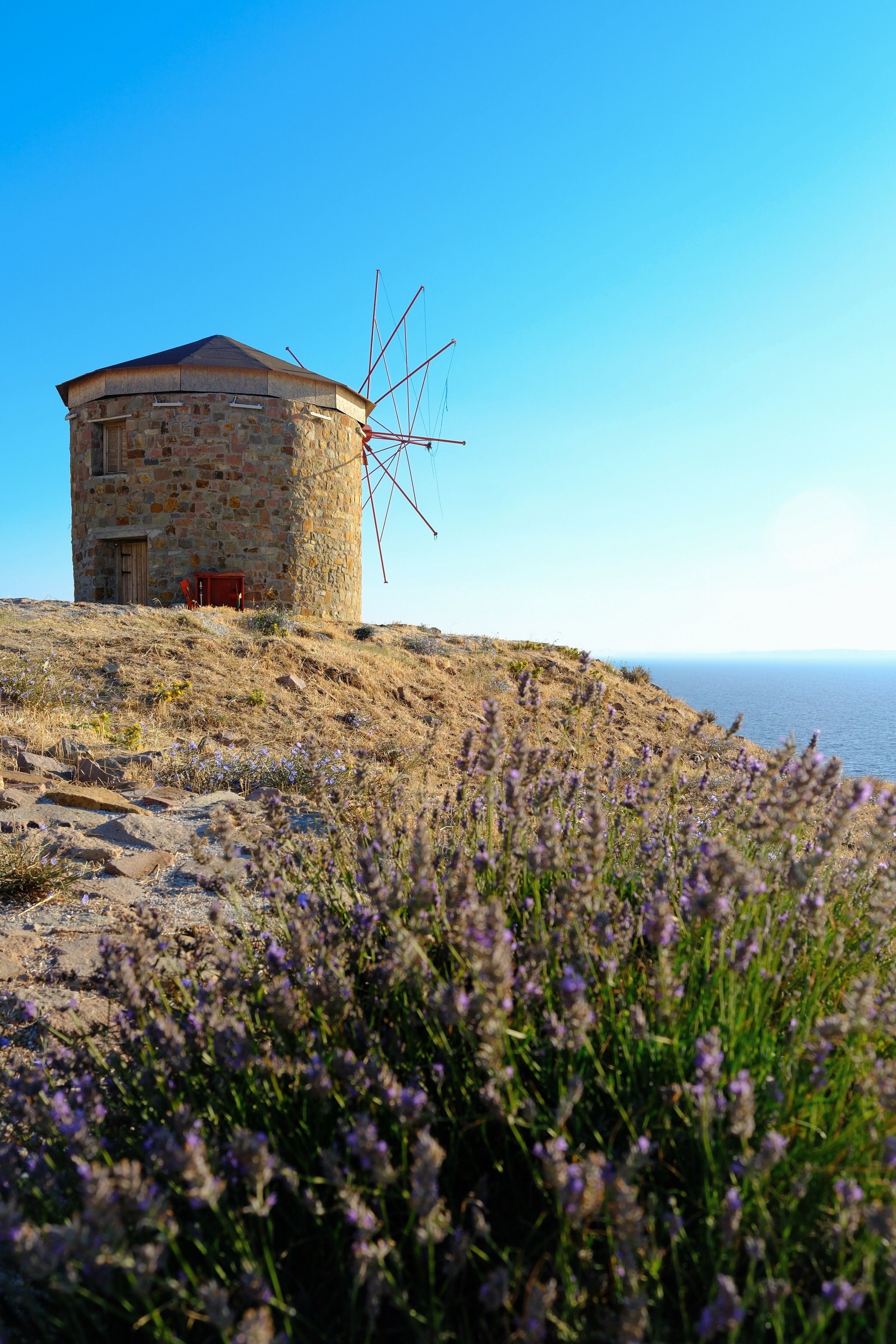 Rustic Stone Windmill Overlooking the Sea · Free Stock Photo