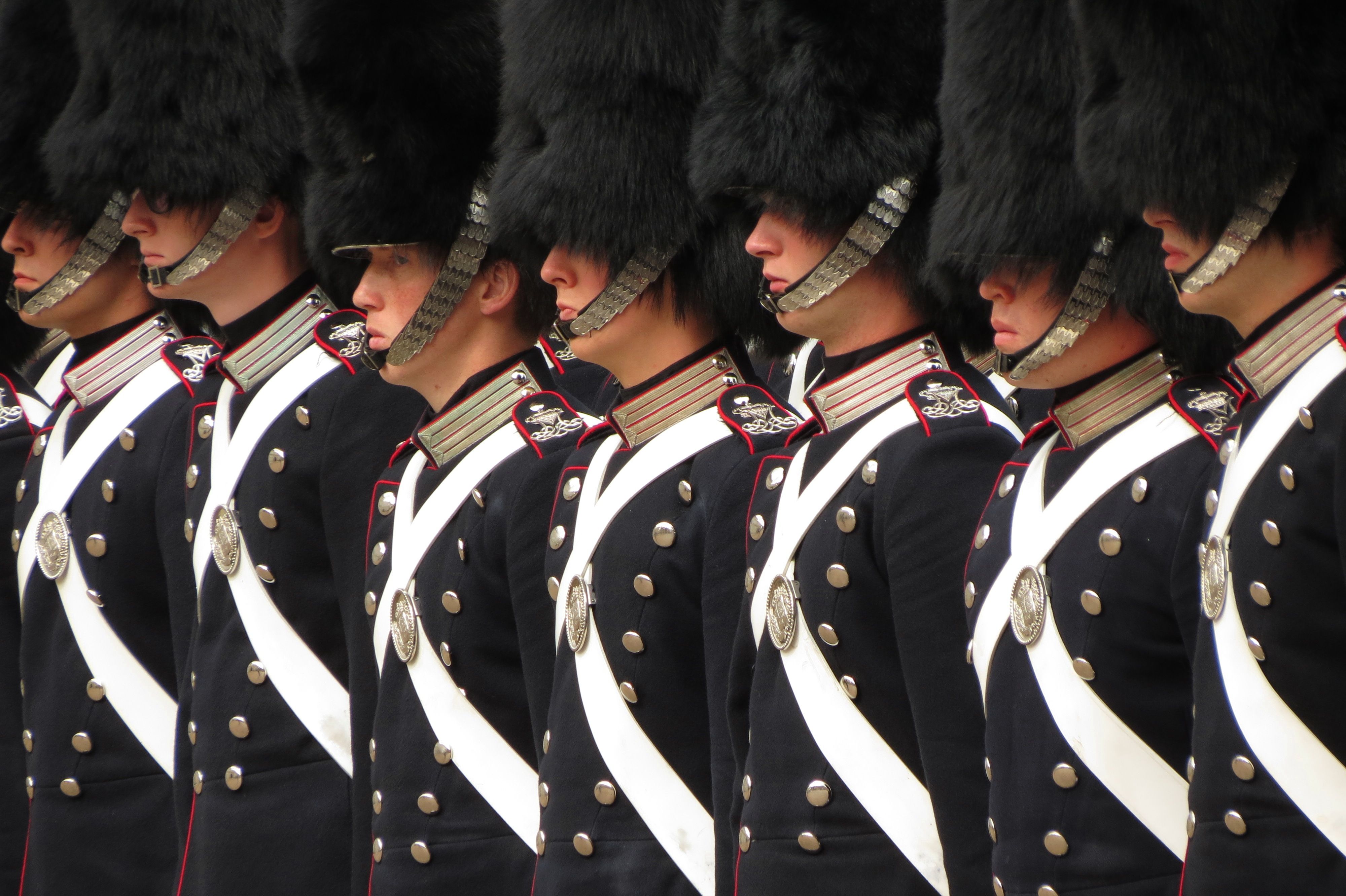 Royal Guards in Traditional Uniforms Performing Ceremony · Free Stock Photo