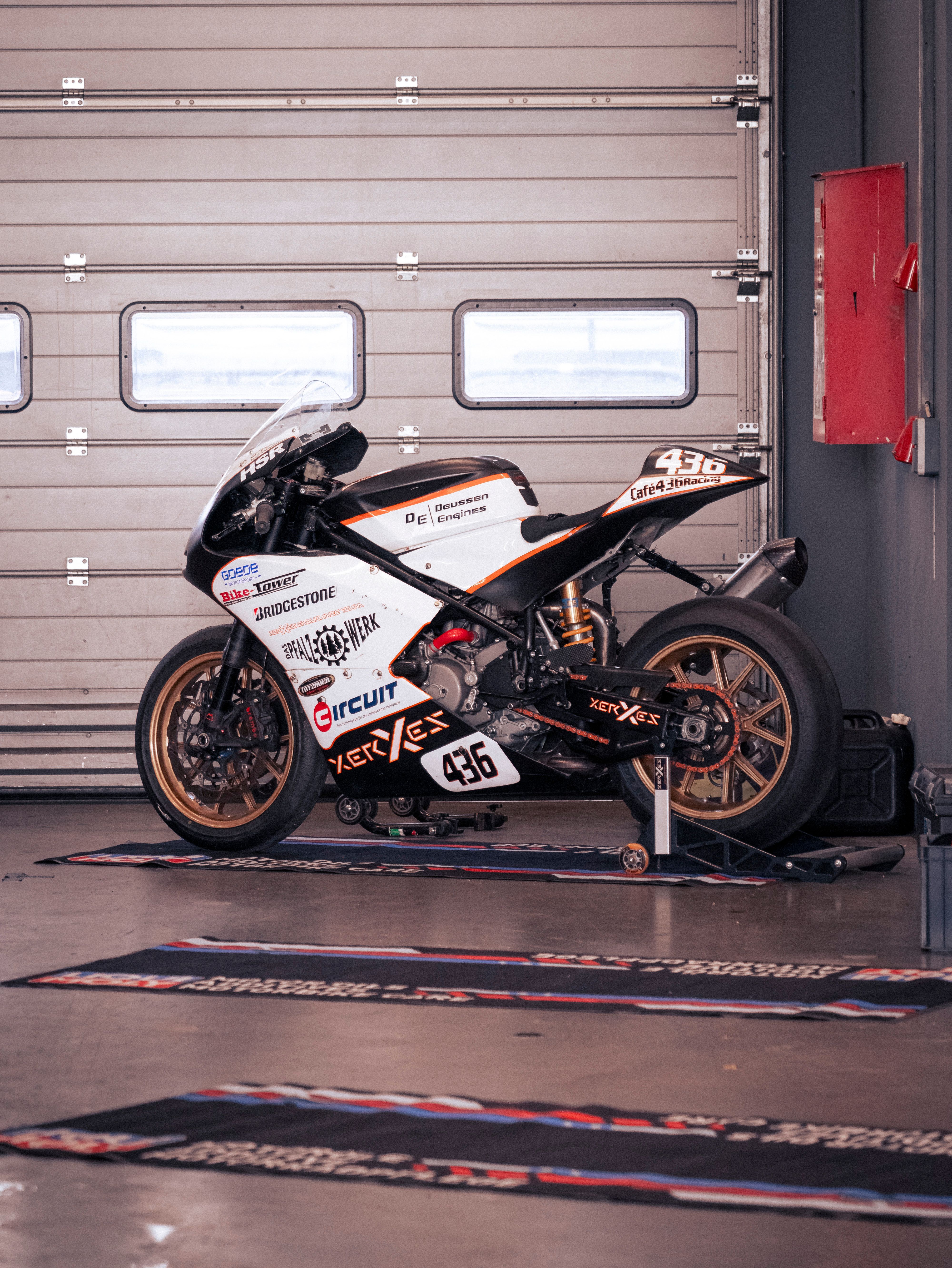 Racing Motorcycle in Nürburg Garage Interior · Free Stock Photo