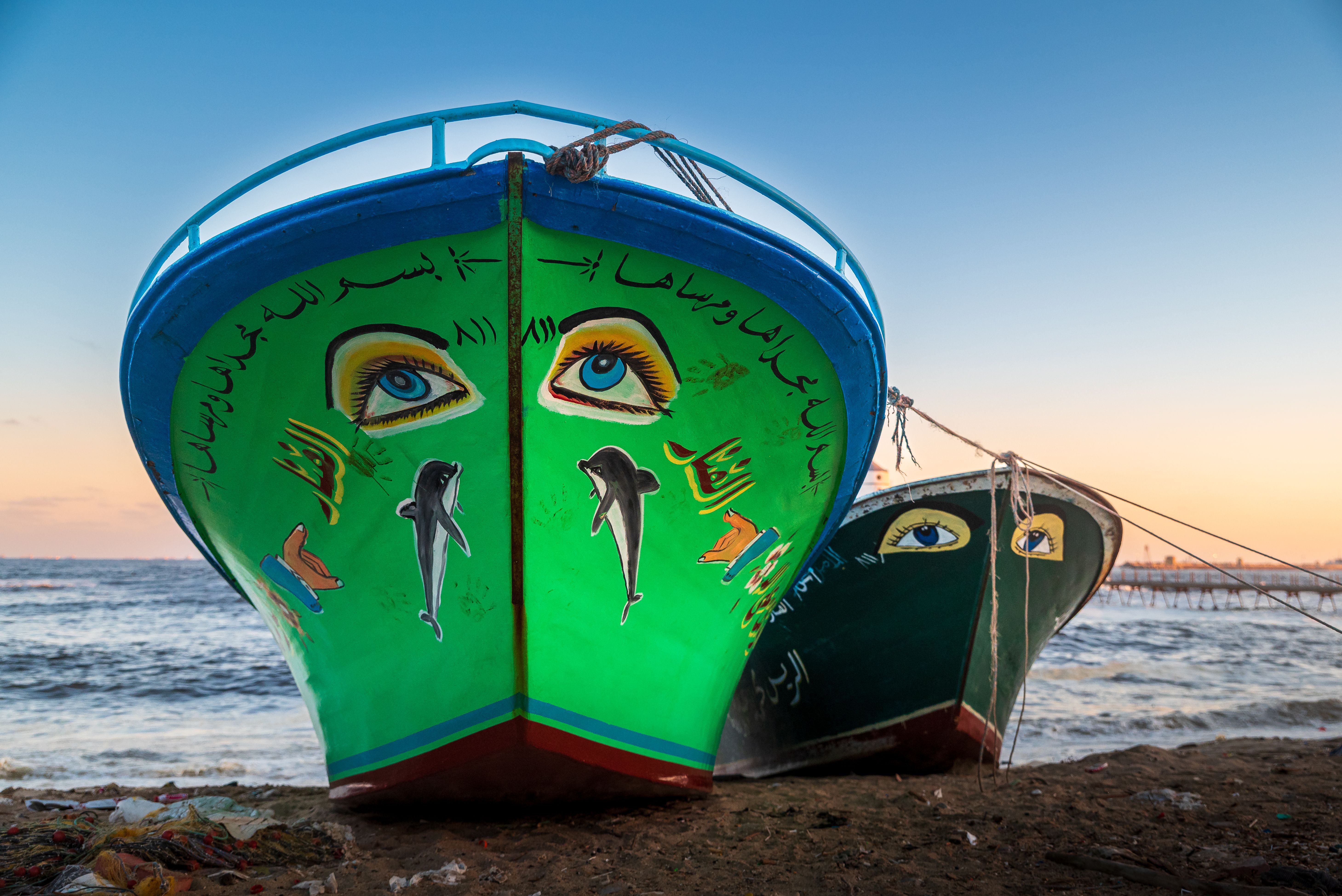 Vibrant Fishing Boats on Alexandria Shoreline at Dusk · Free Stock Photo