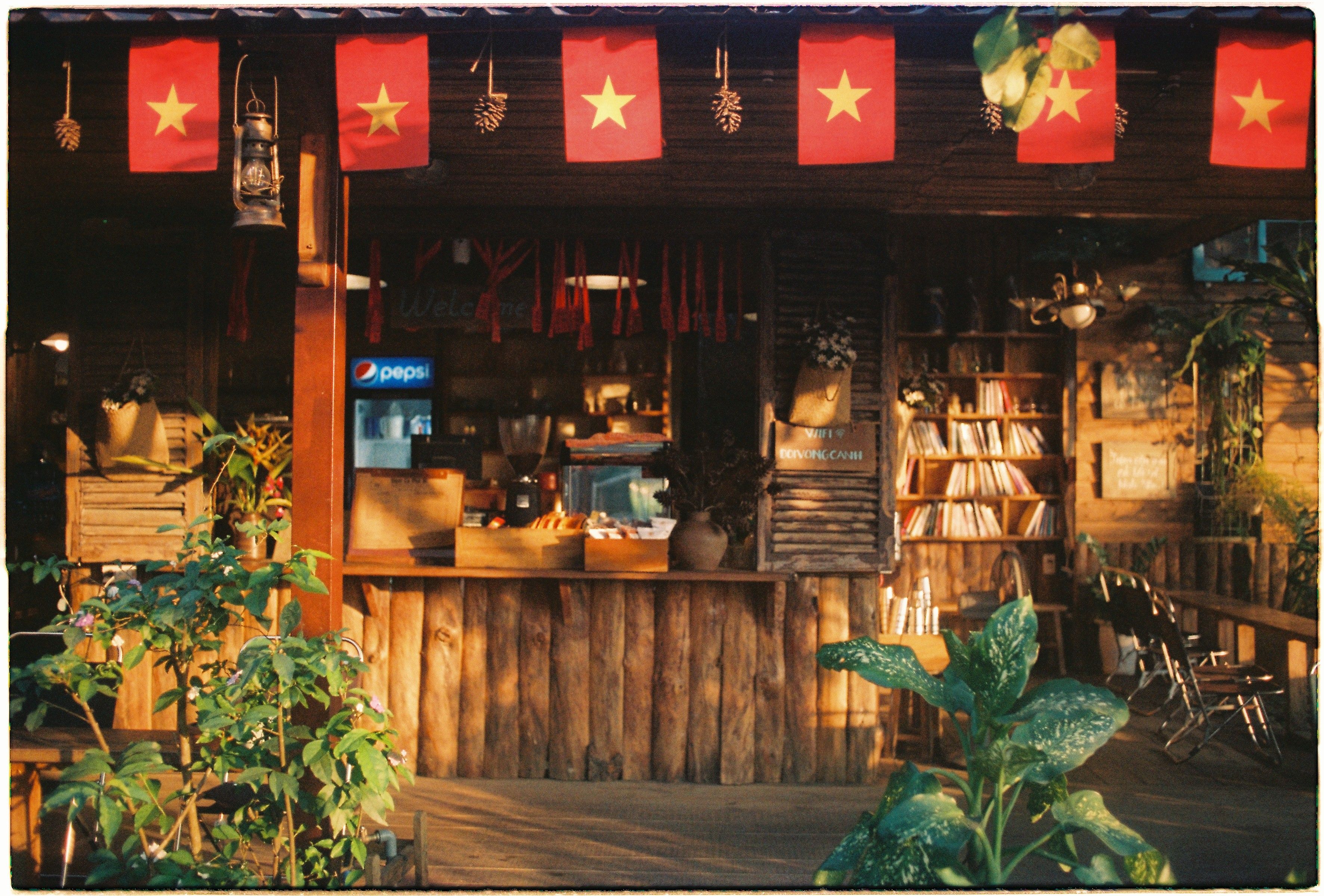 Cozy Outdoor Café with Flags and Vintage Decor · Free Stock Photo