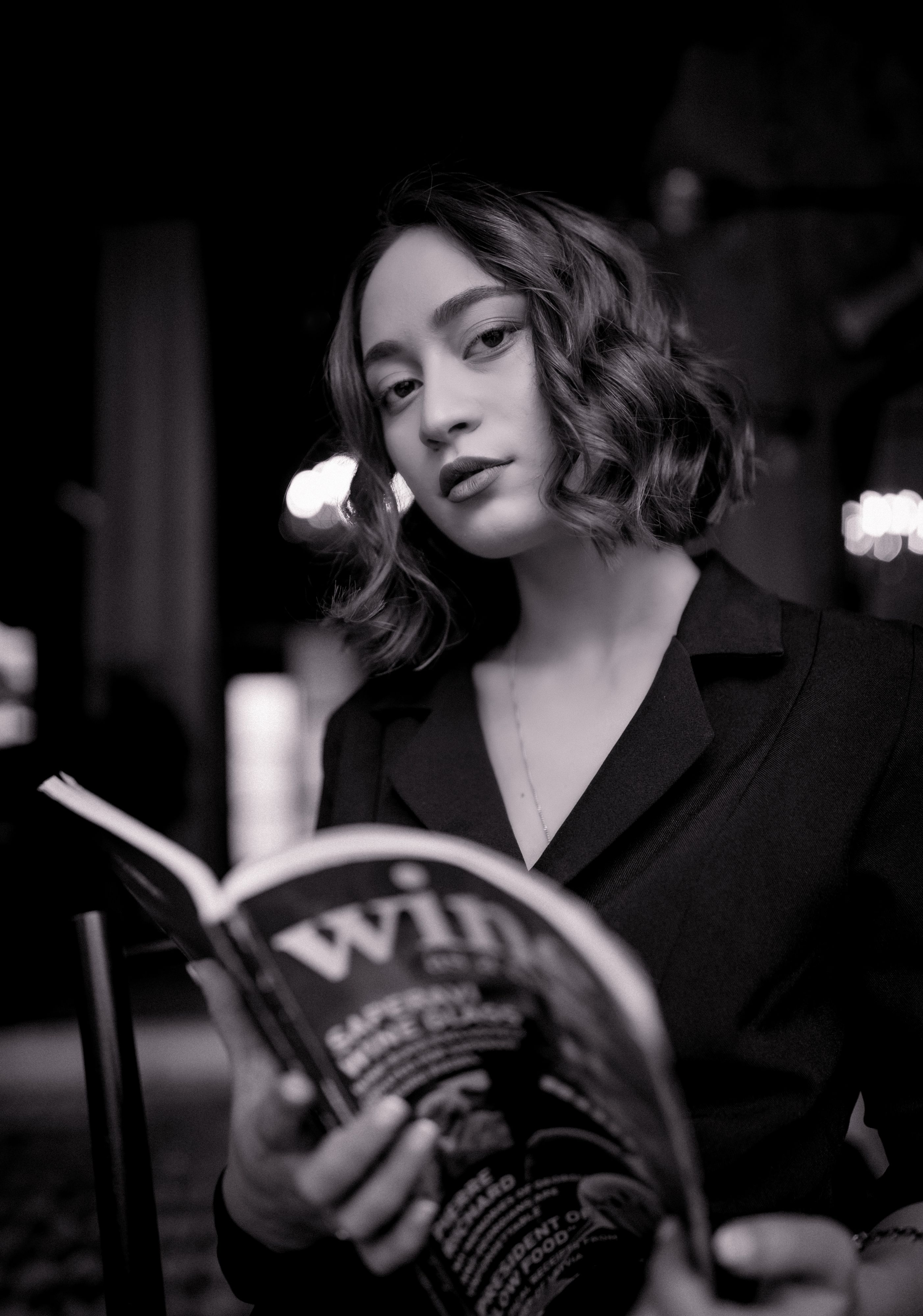 Monochrome Portrait of a Woman Reading Indoors · Free Stock Photo