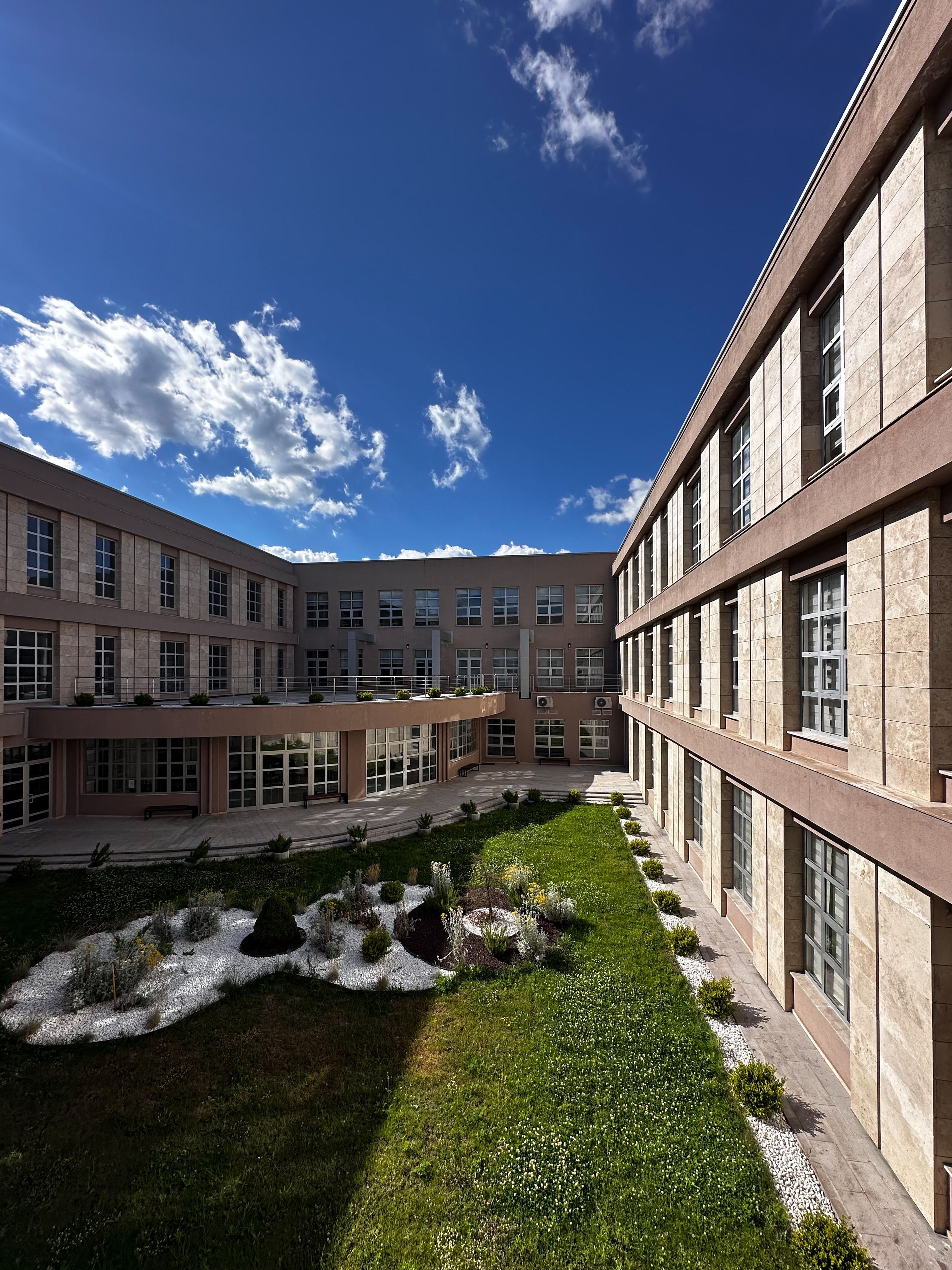 Modern Courtyard Architecture with Blue Sky · Free Stock Photo