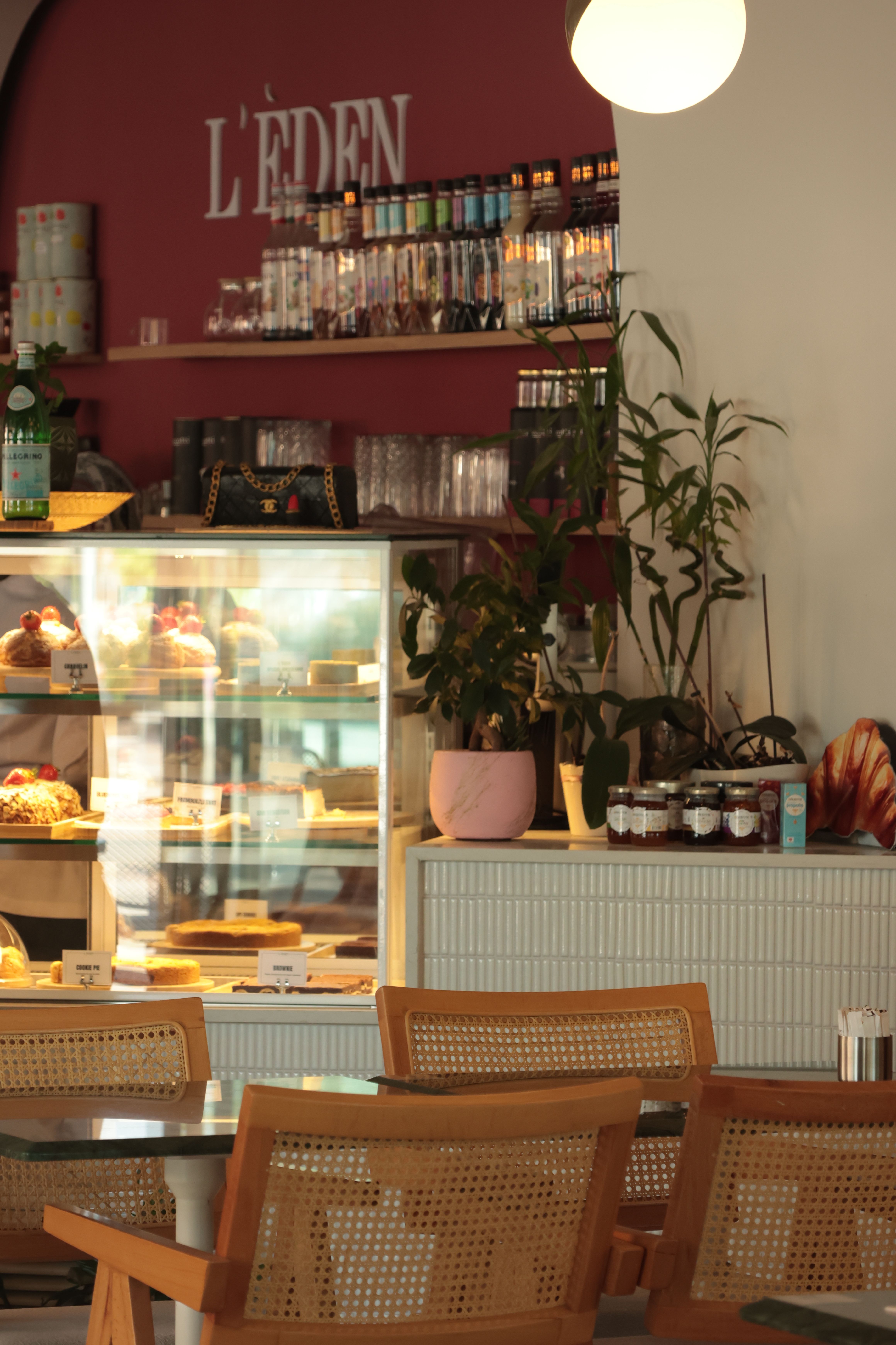 Cozy Cafe Interior with Pastry Display · Free Stock Photo