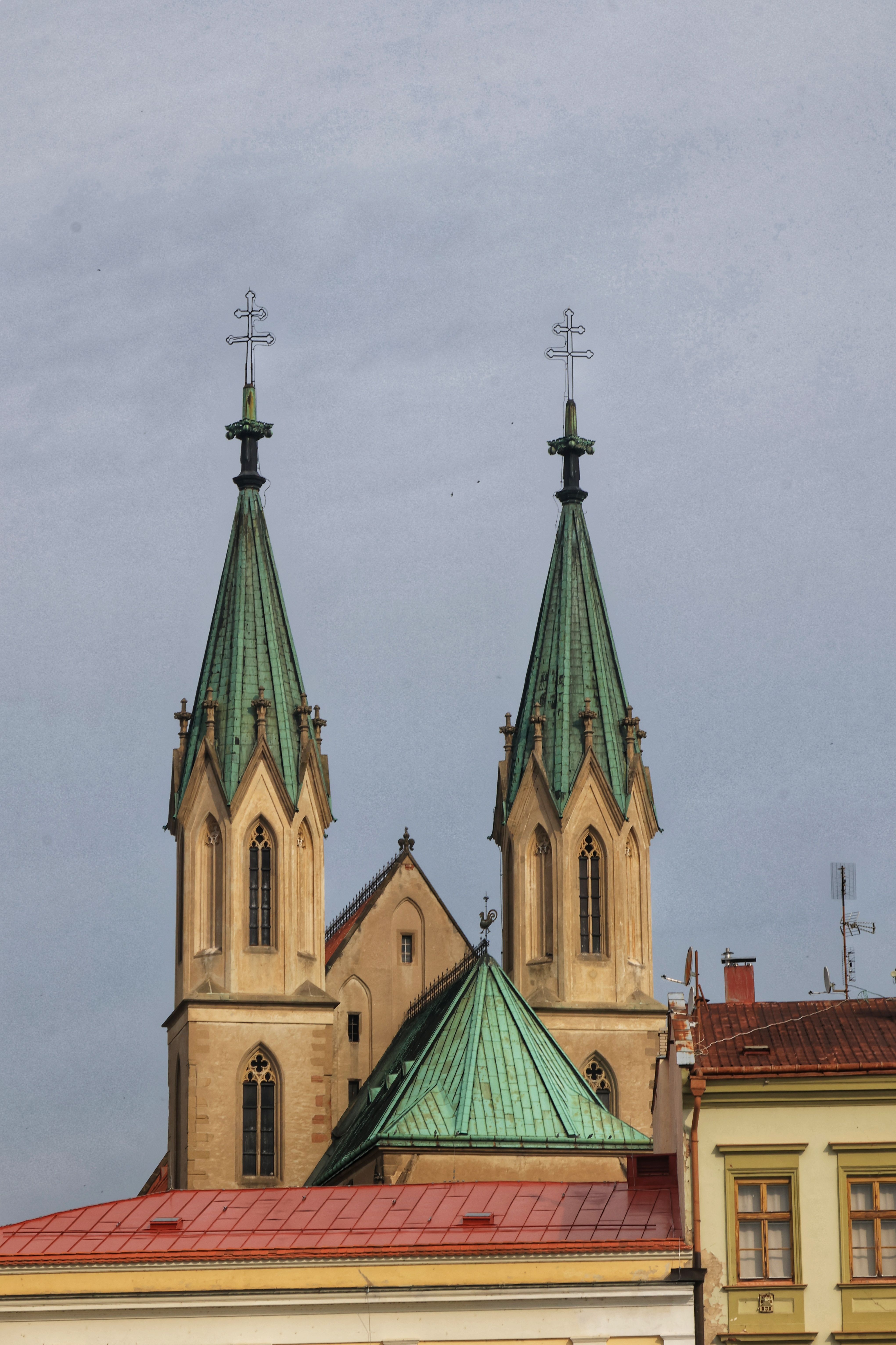 Gothic Revival Church Spires with Green Roofs · Free Stock Photo