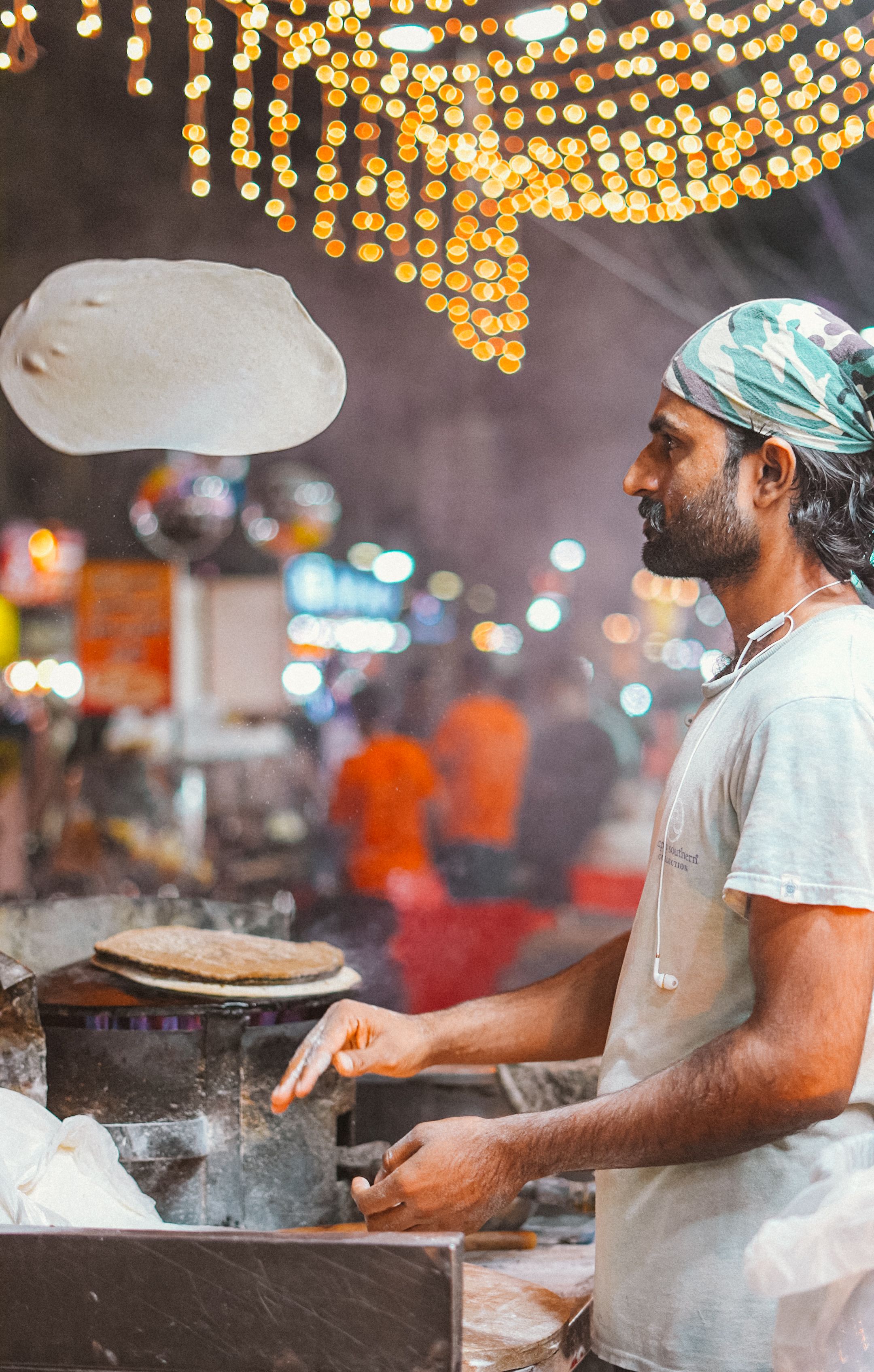 Traditional South Asian Bread Making at Night Market · Free Stock Photo