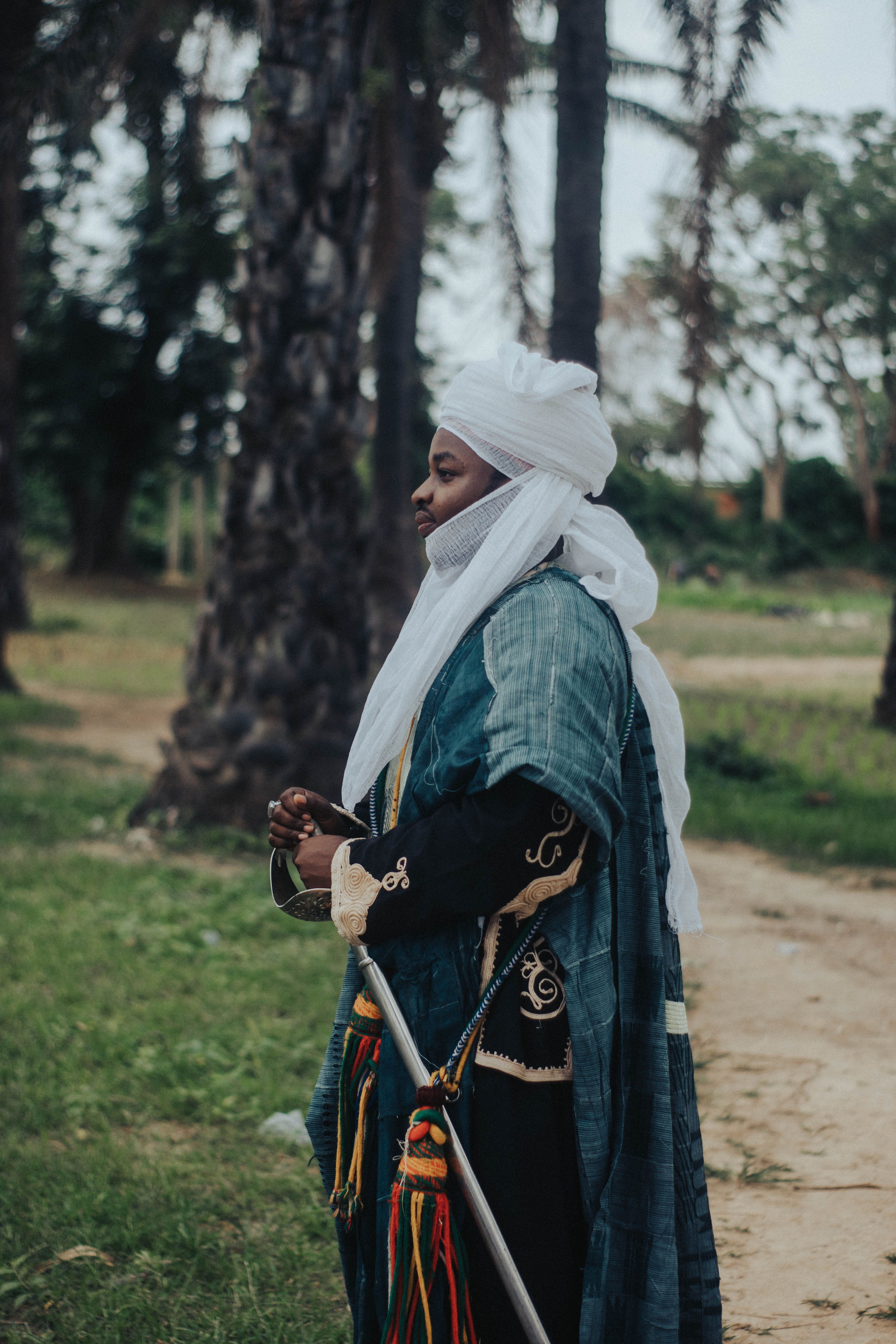 Traditional Attire Outdoors with Palm Trees · Free Stock Photo
