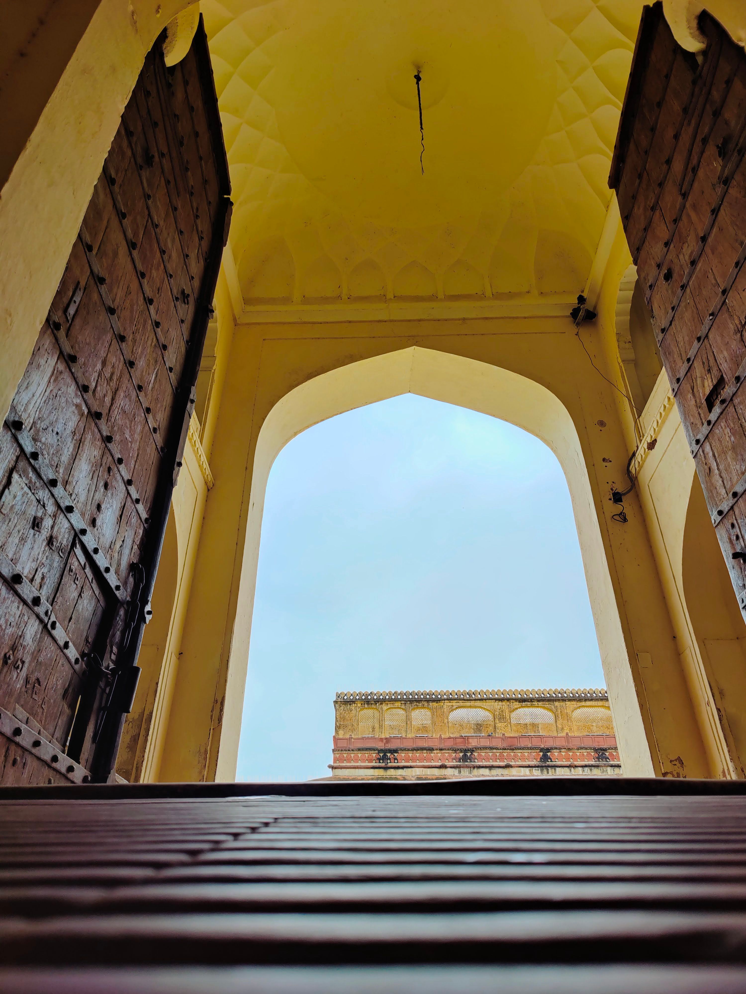 Majestic View Through Historical Arched Doorway · Free Stock Photo