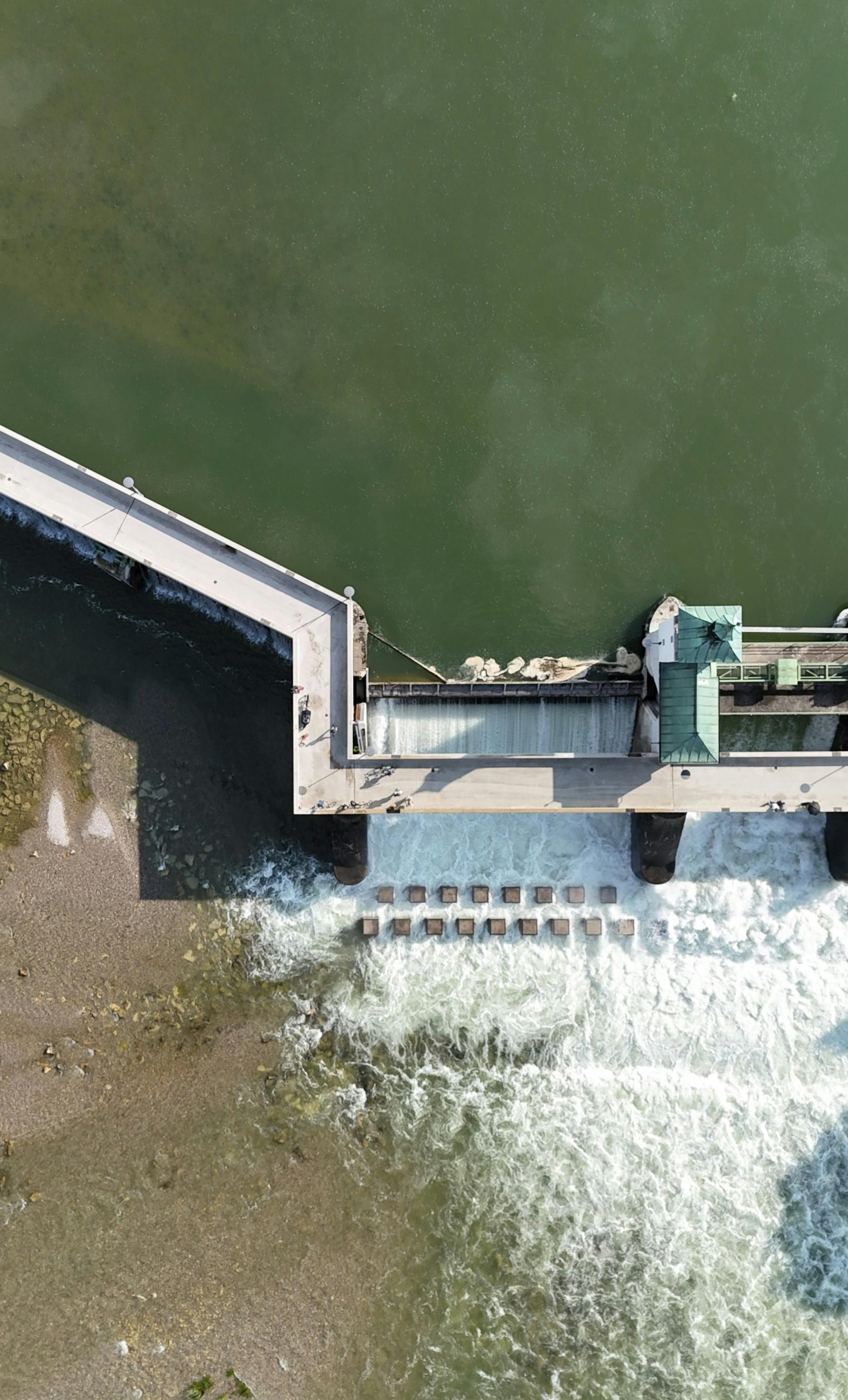 Aerial View of Dam Structure with Flowing Water · Free Stock Photo