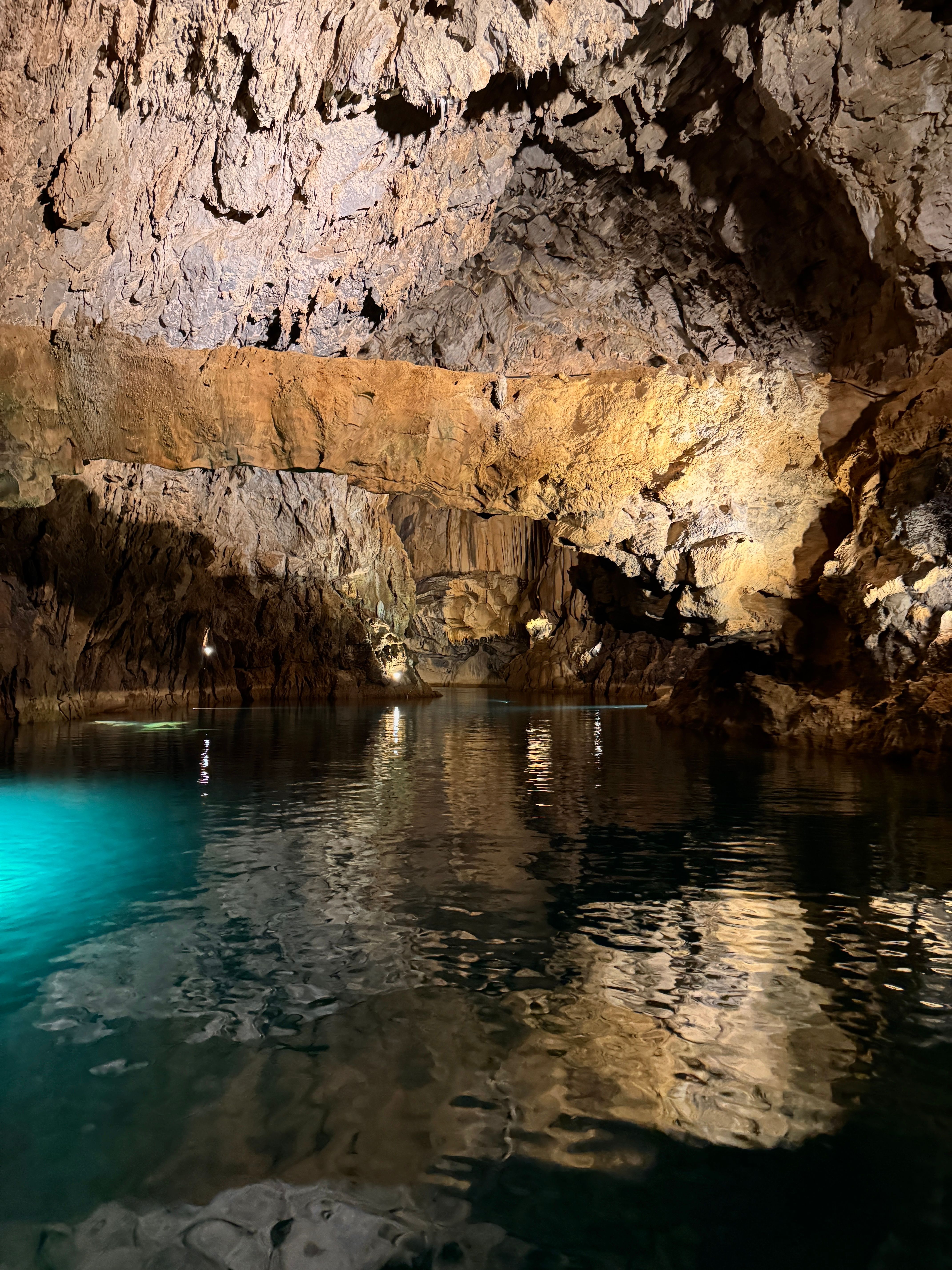 A Man Standing in the Middle of the Cave Surrounded with Water · Free ...