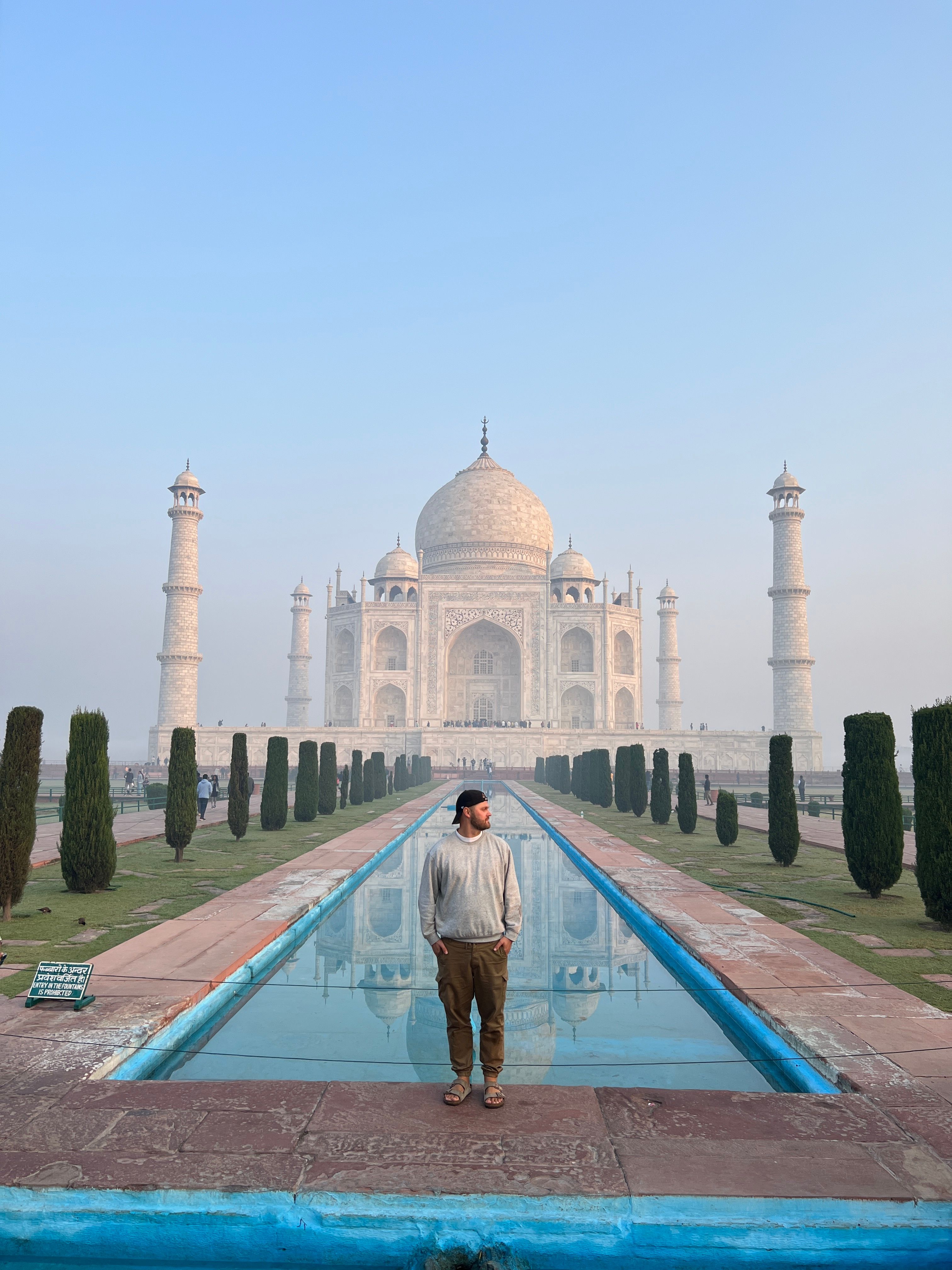 Back View of Woman Posing by Taj Mahal · Free Stock Photo