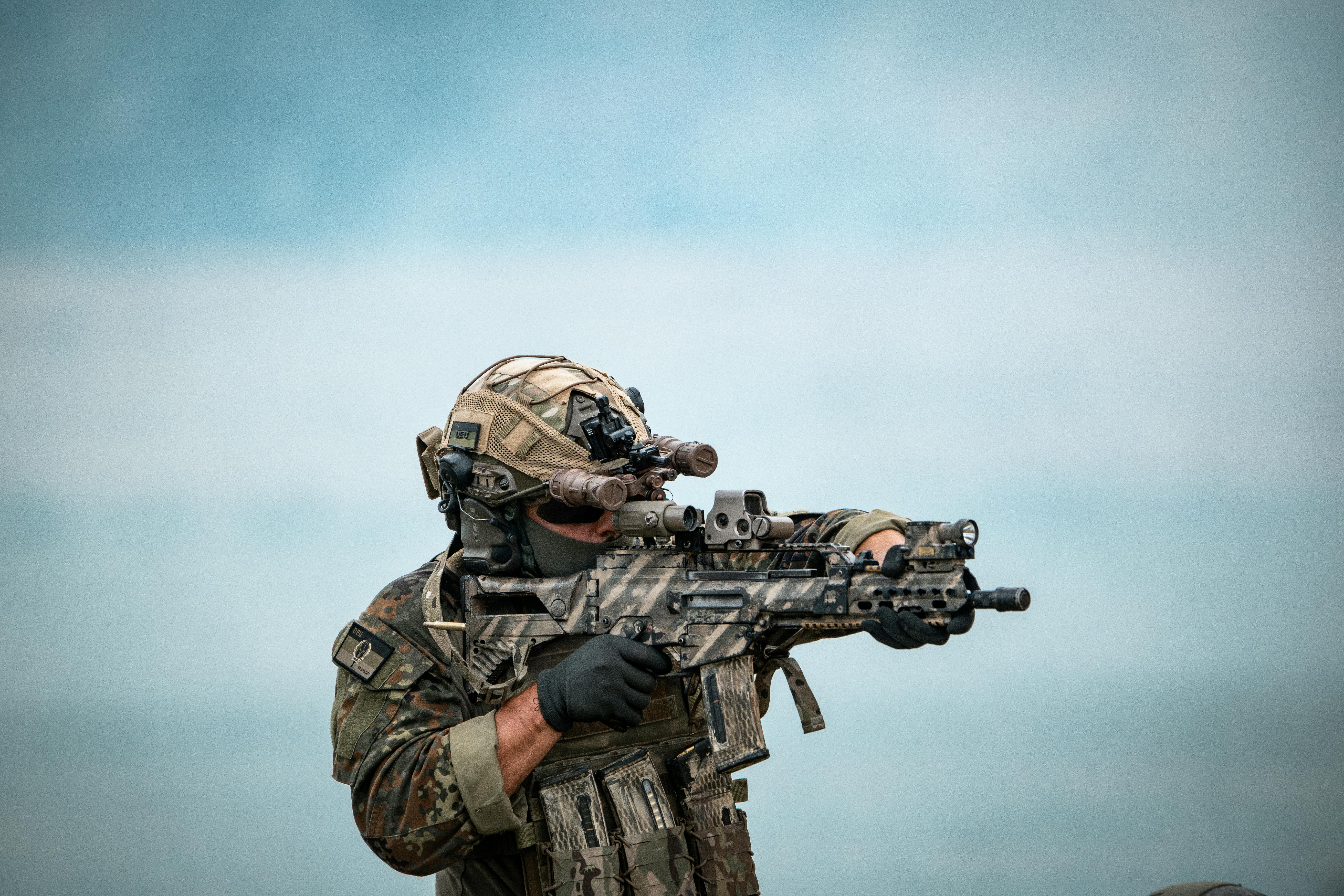 Military Soldier in Camouflage Aiming Rifle · Free Stock Photo