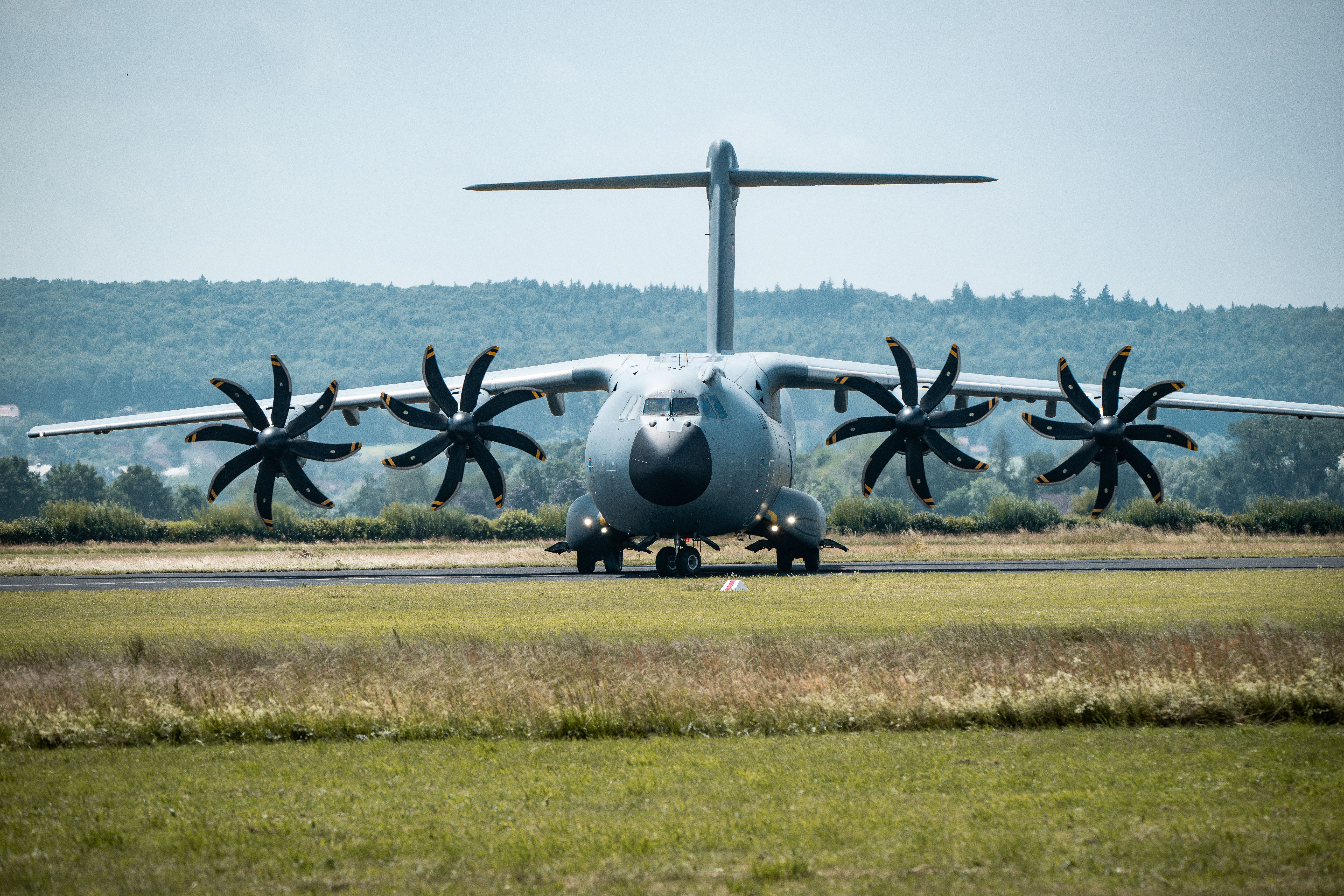 Military A400M Aircraft on Runway Daytime Scene · Free Stock Photo