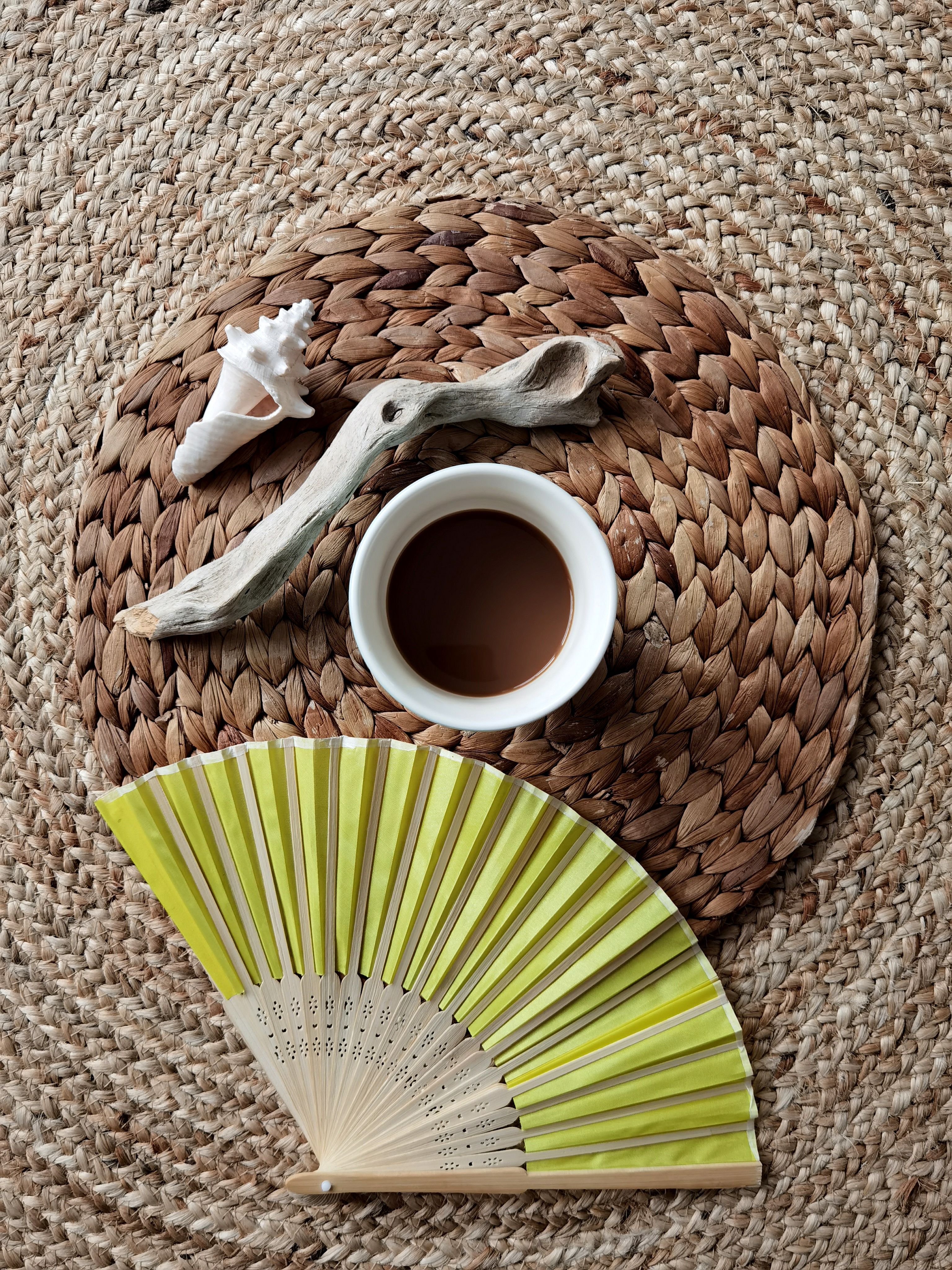 Flat Lay of Coffee with Shell and Fan · Free Stock Photo