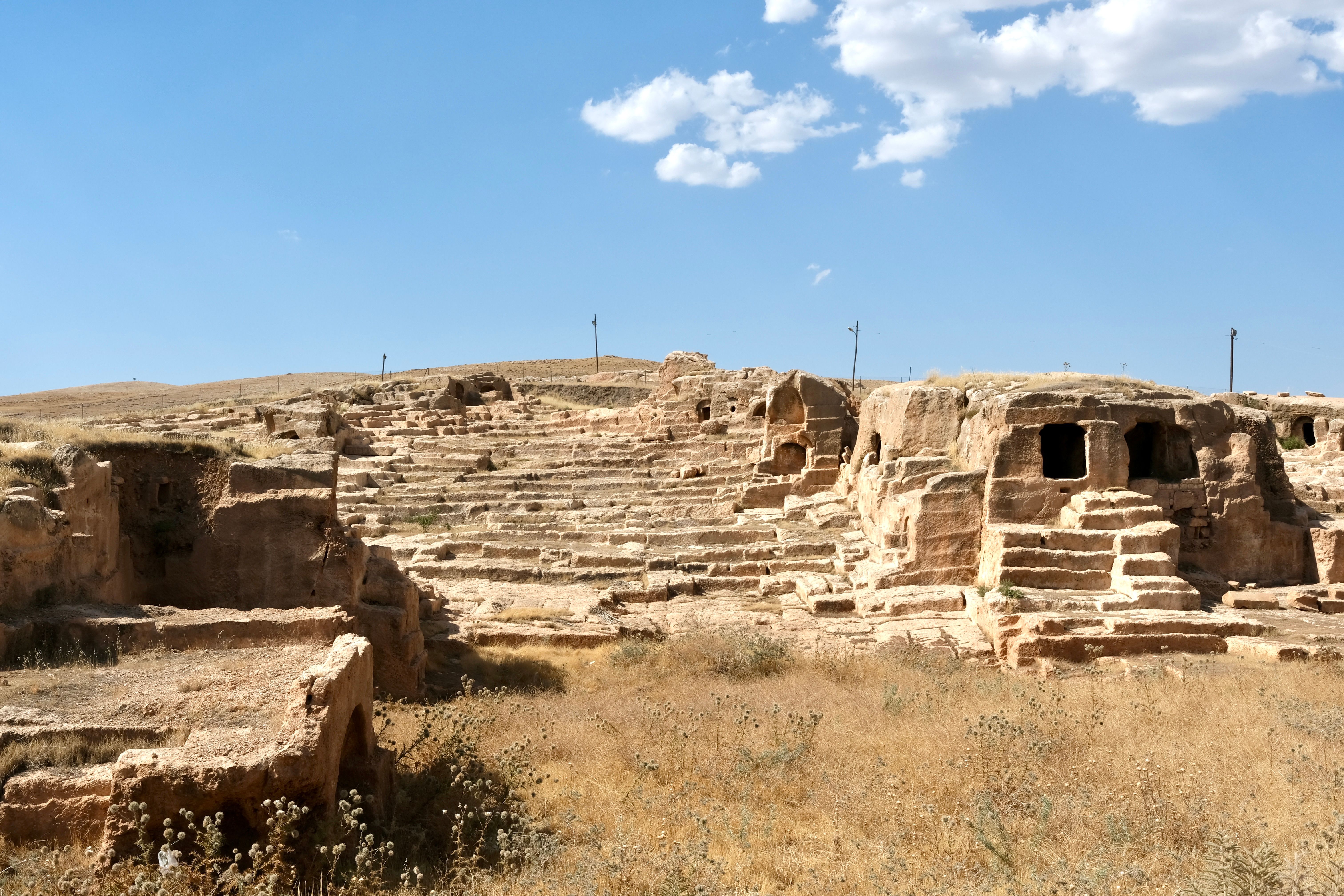 Ancient Rock-Cut Caves in Historical Landscape · Free Stock Photo