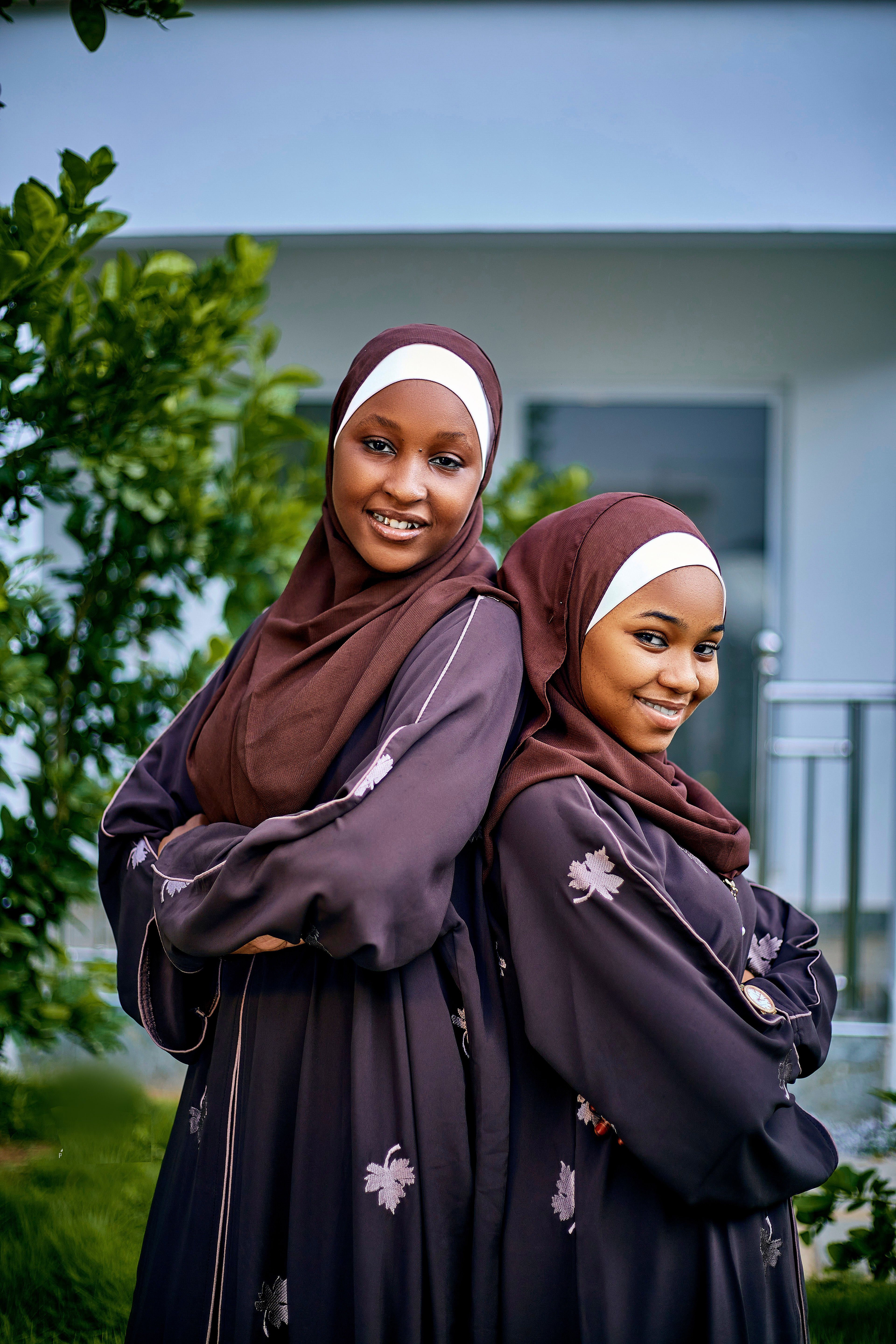 Two Women in Hijabs Smiling Outdoors · Free Stock Photo