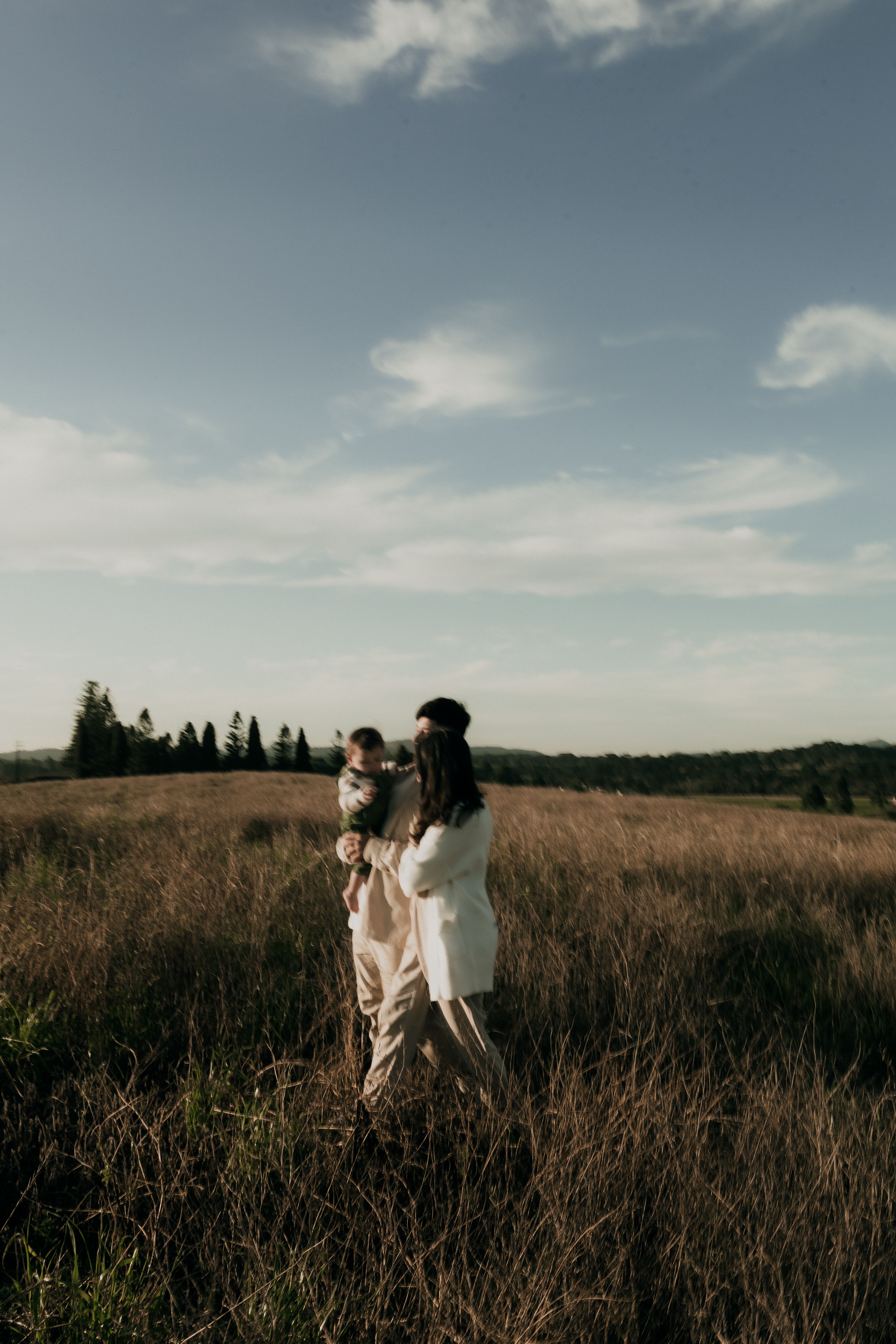 Family Stroll in Peaceful Countryside Landscape · Free Stock Photo