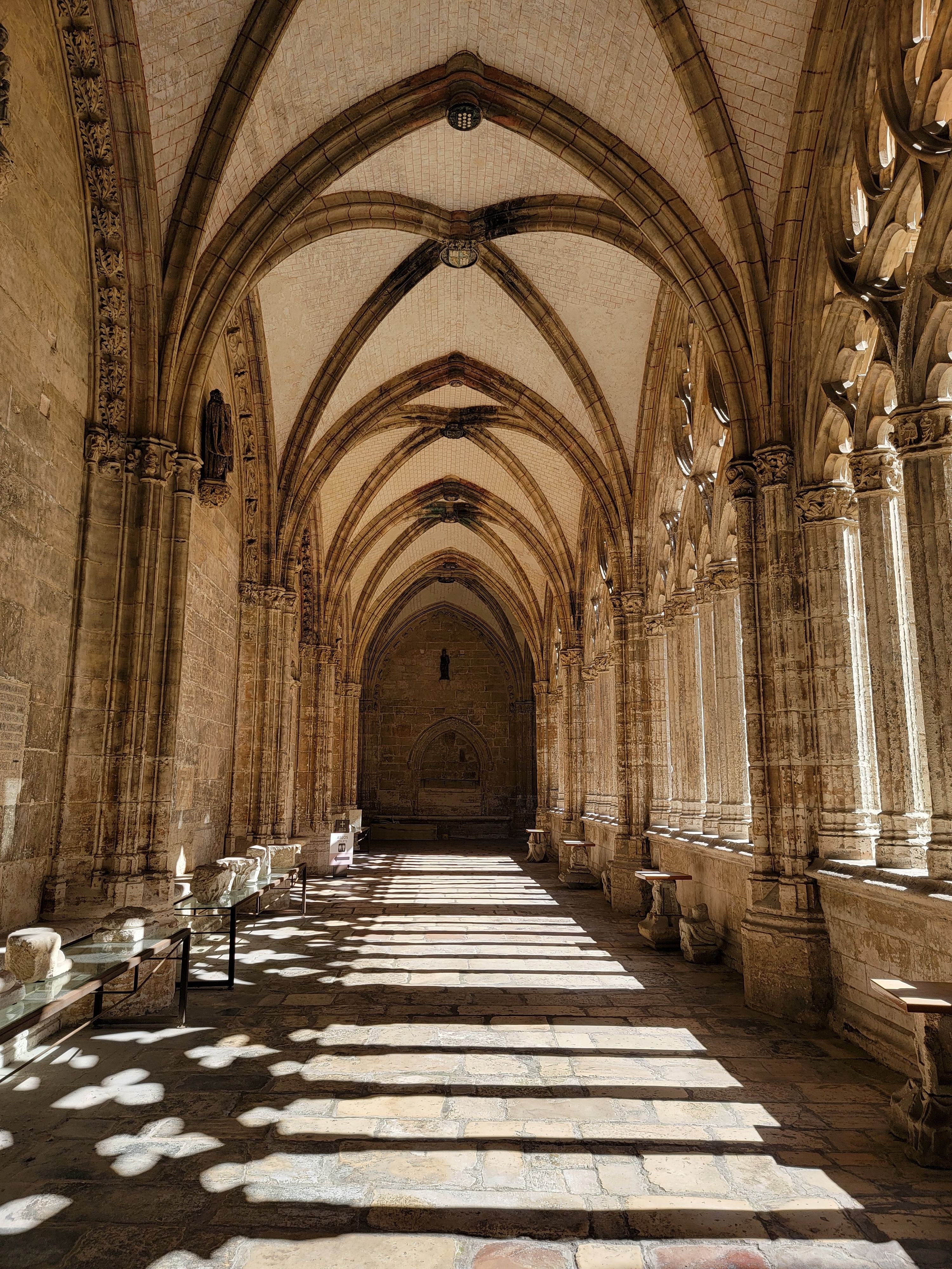 Gothic Cloister Interior with Arched Shadows · Free Stock Photo