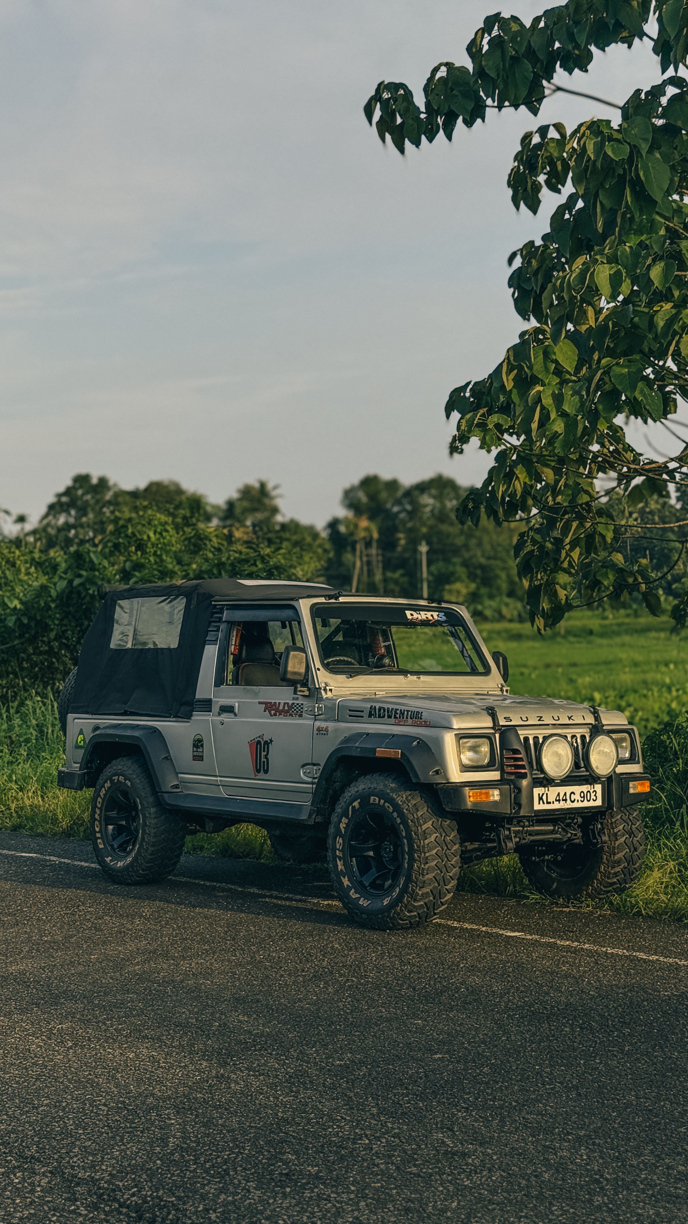 Classic Off-Road Vehicle Parked on Scenic Road · Free Stock Photo