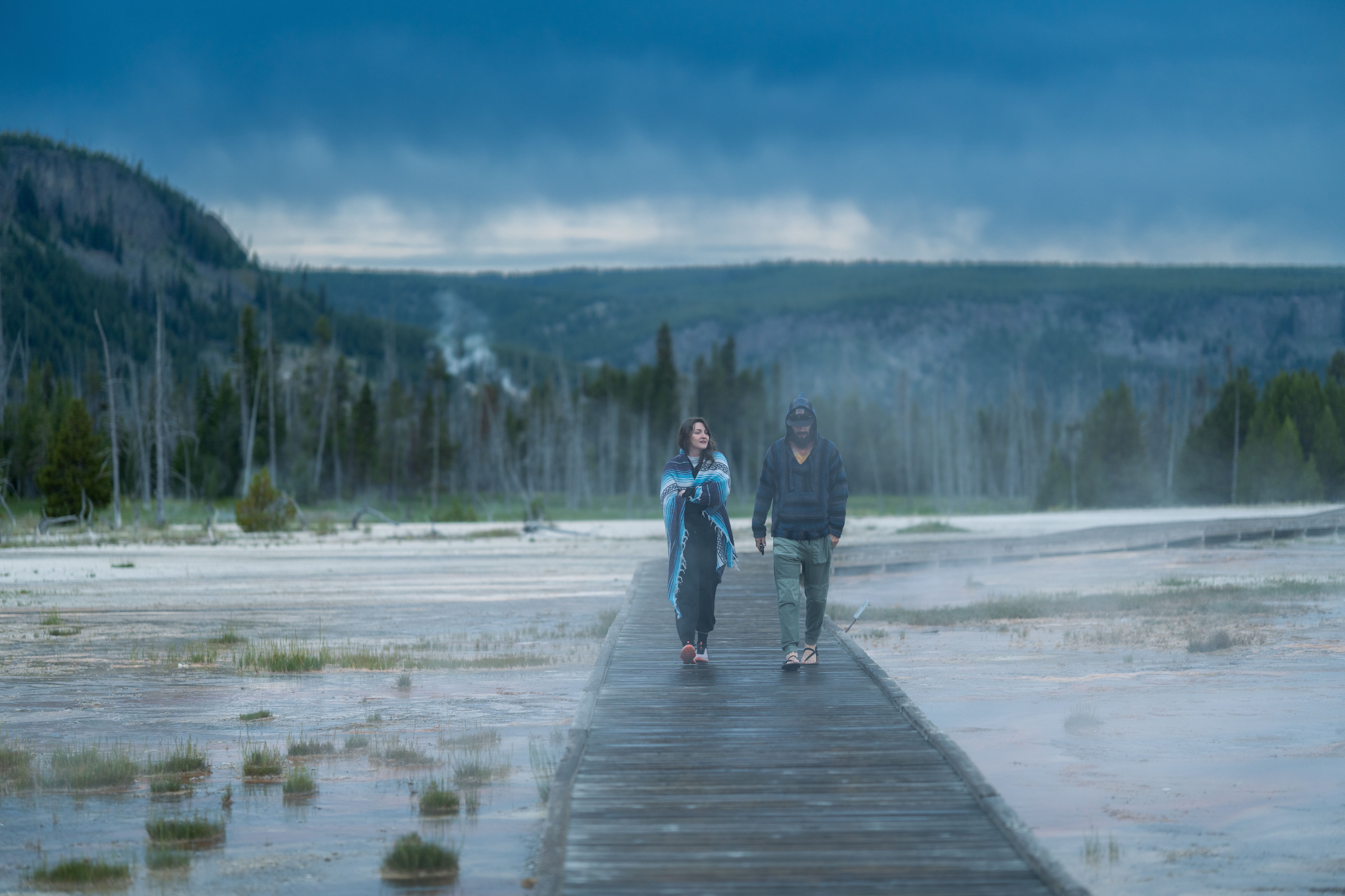 Couple Walking on Wooden Path in Misty Yellowstone · Free Stock Photo