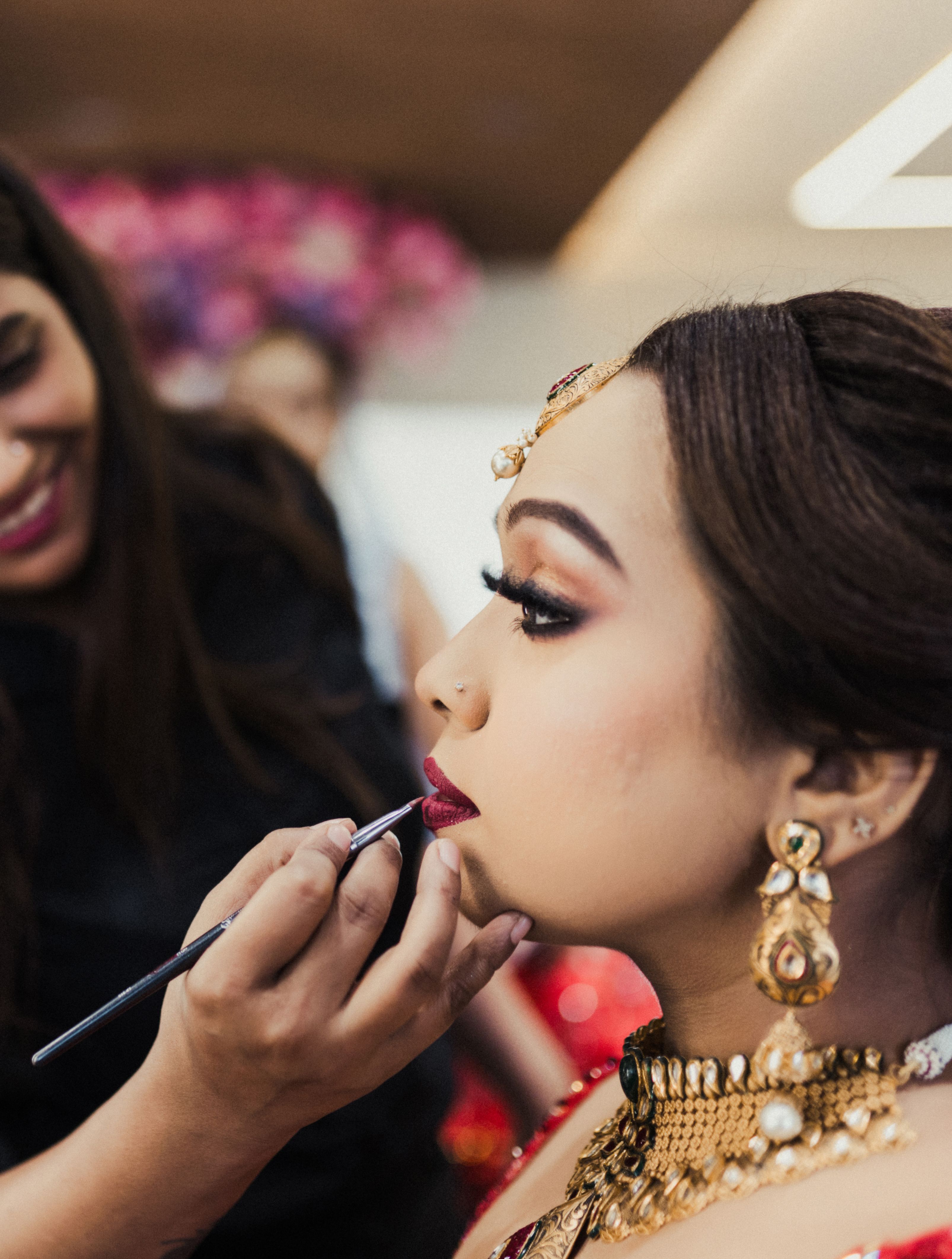 Makeup Artist Applying Eyeshadow in Studio · Free Stock Photo
