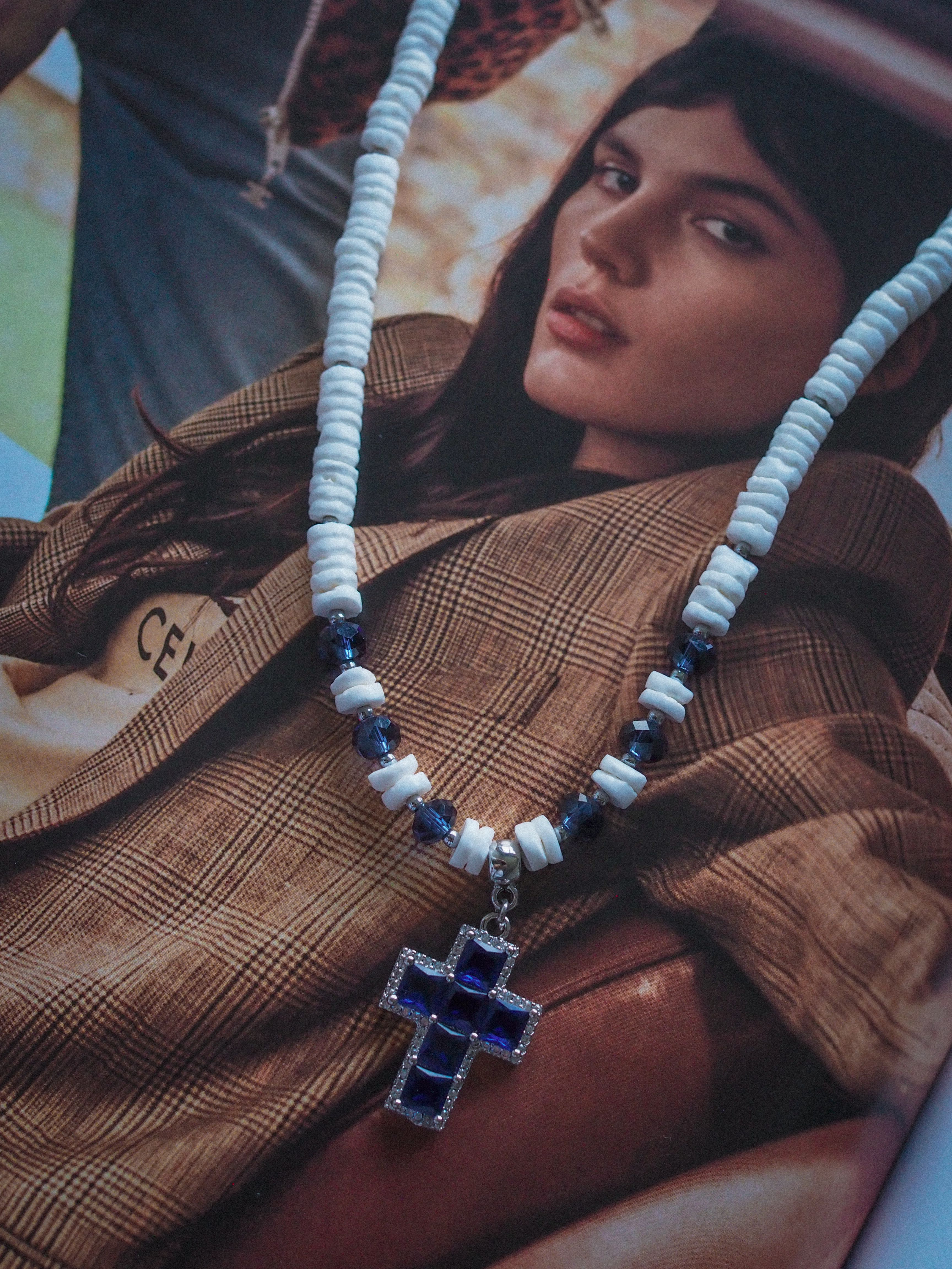Trendy Cross Pendant Necklace on Fashion Magazine · Free Stock Photo