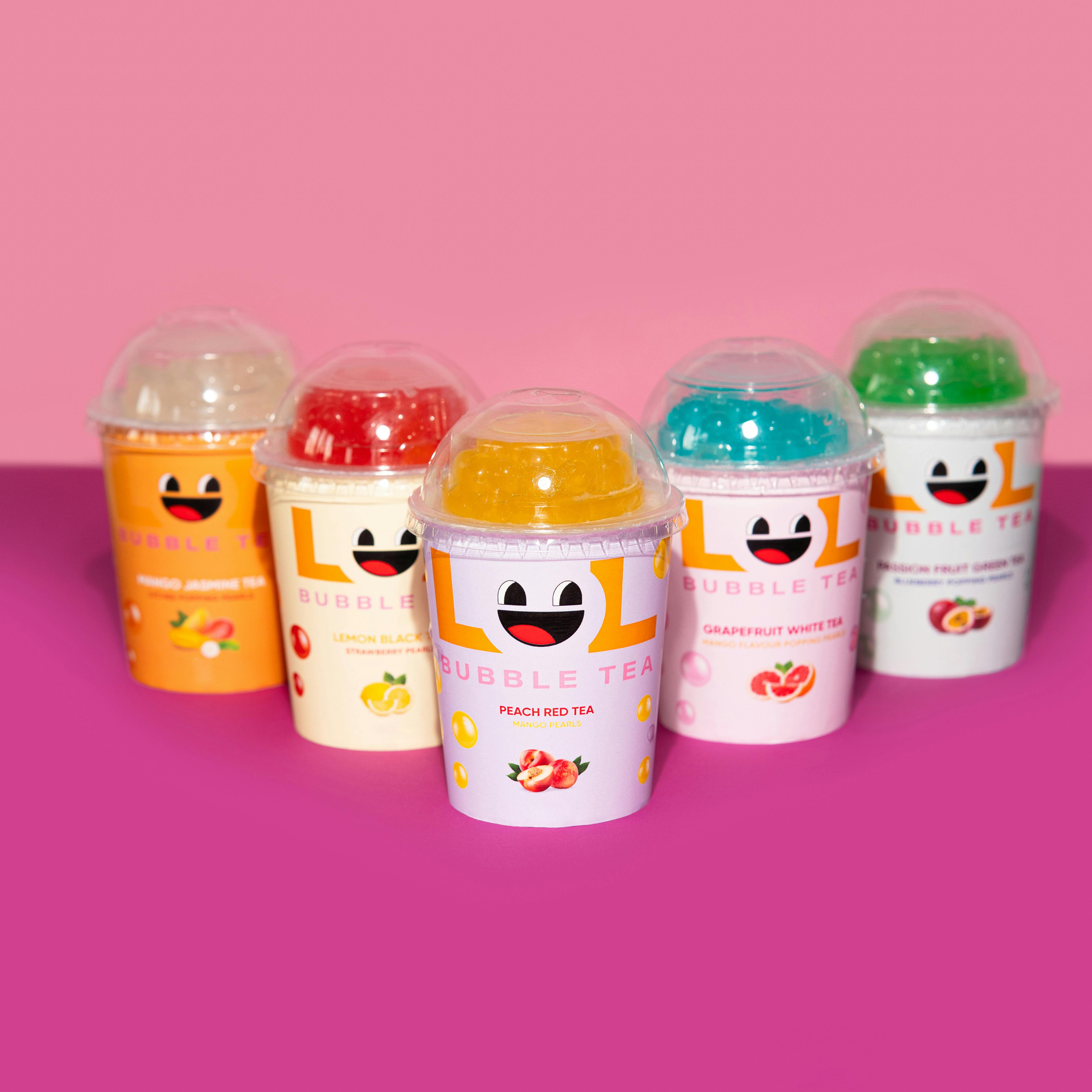 Colorful Bubble Tea Cups on Pink Background · Free Stock Photo