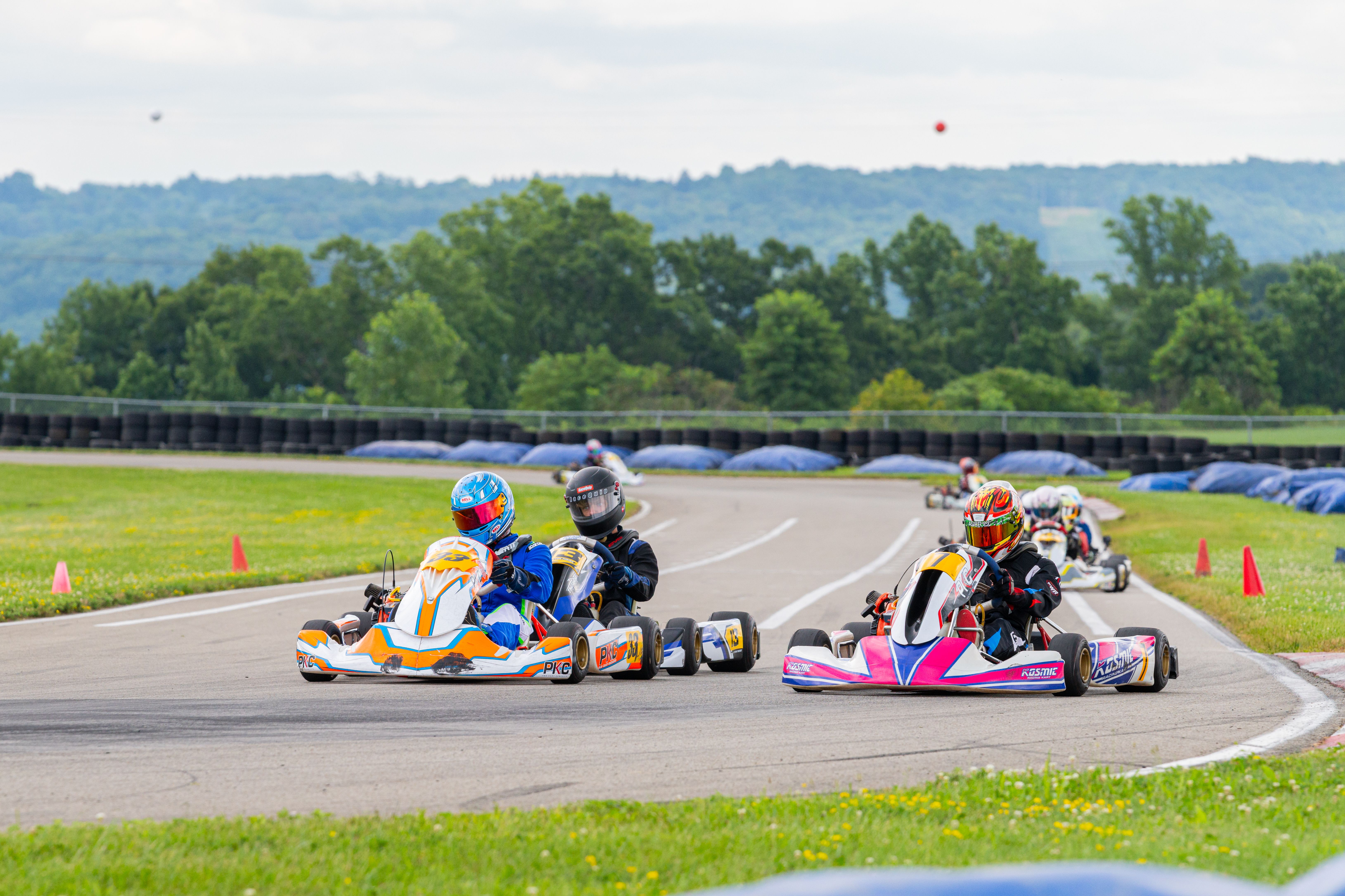 Three Men Riding on Go Karts · Free Stock Photo