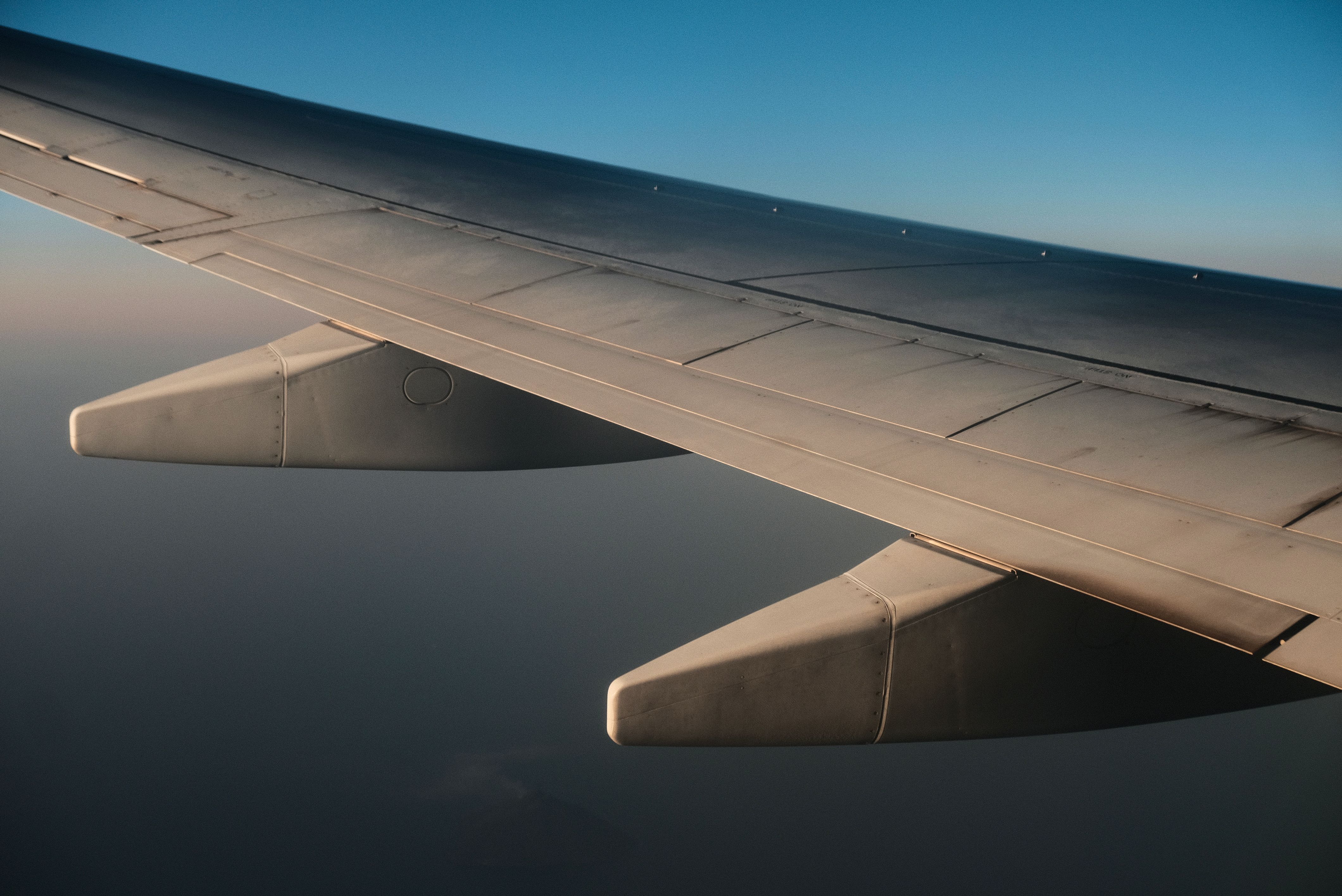 Airplane Wing in Flight Over Clouds · Free Stock Photo